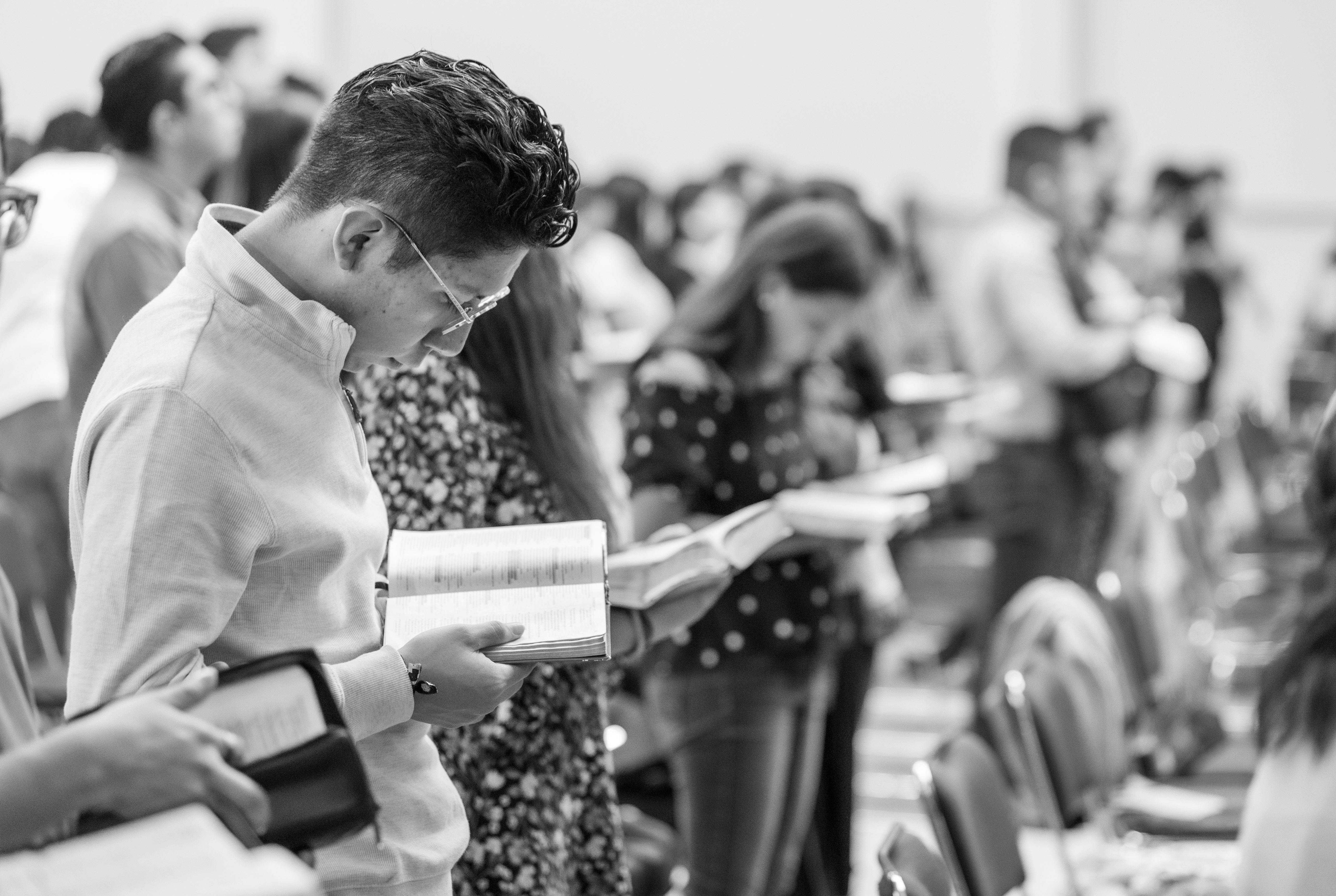 Man among People Reading Bible at Gathering · Free Stock Photo