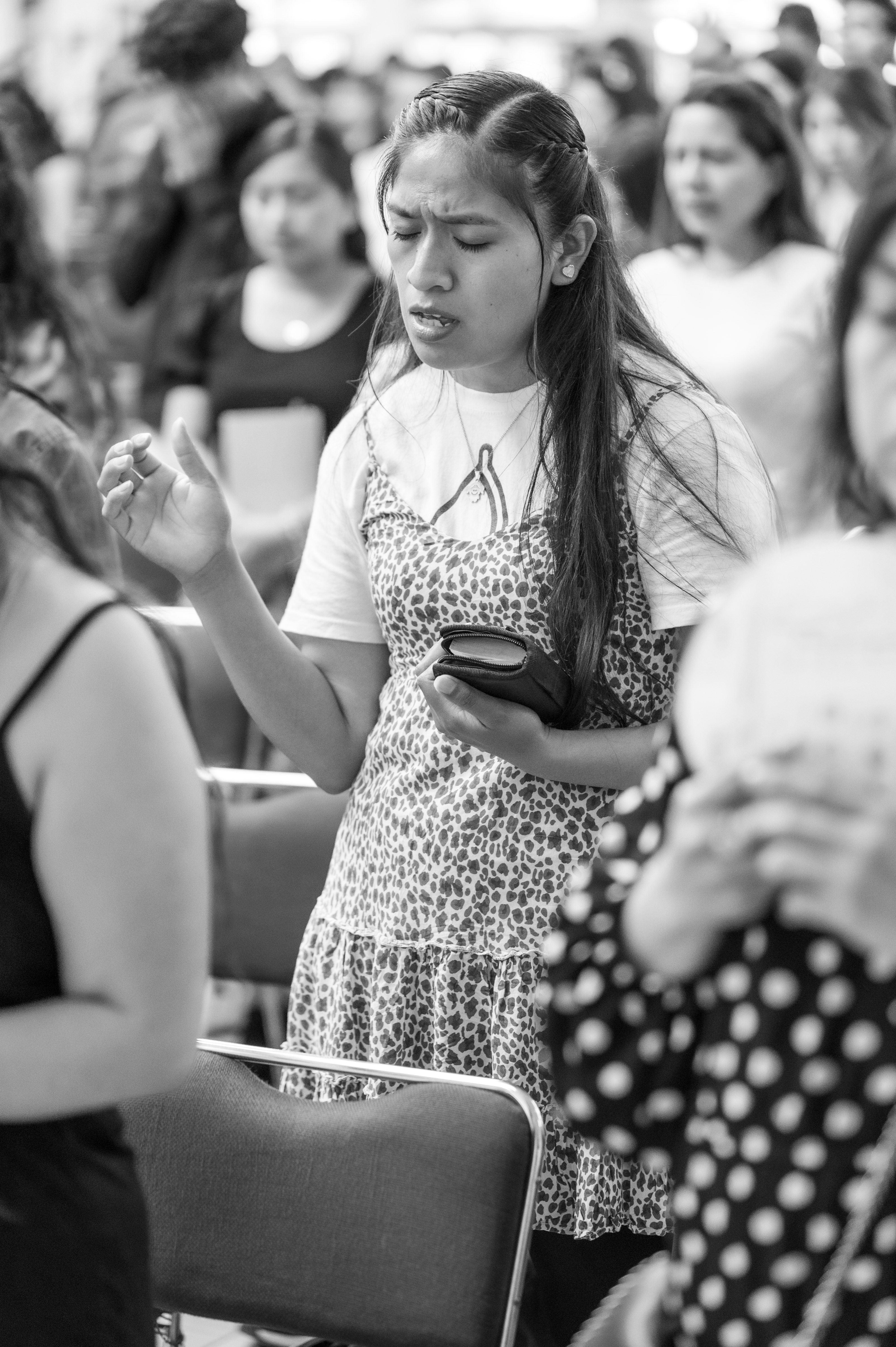 Woman Standing and Praying at Gathering · Free Stock Photo