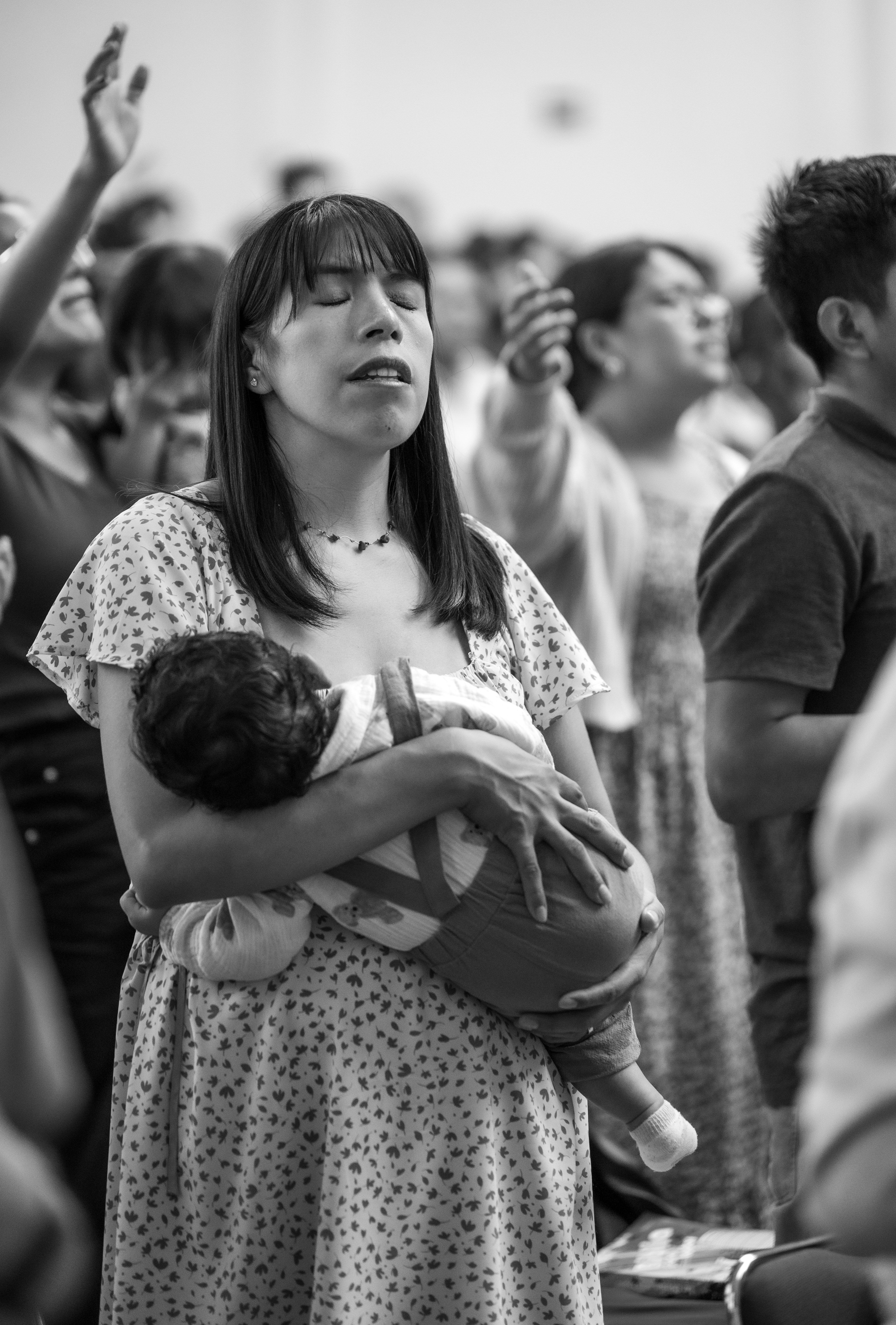 Woman Holding a Baby in Synagogue in Black and White · Free Stock Photo