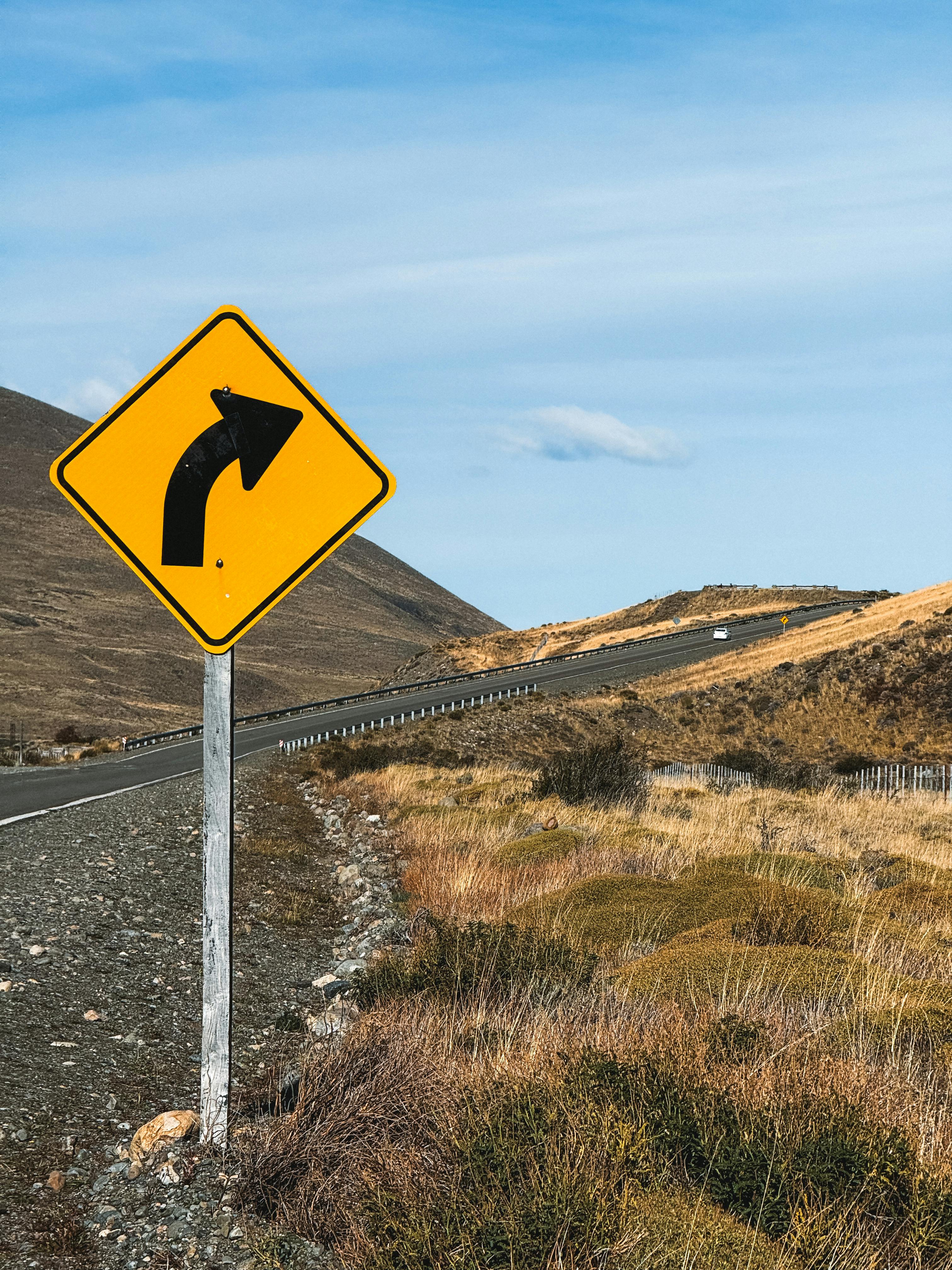 Traffic Sign by the Road · Free Stock Photo