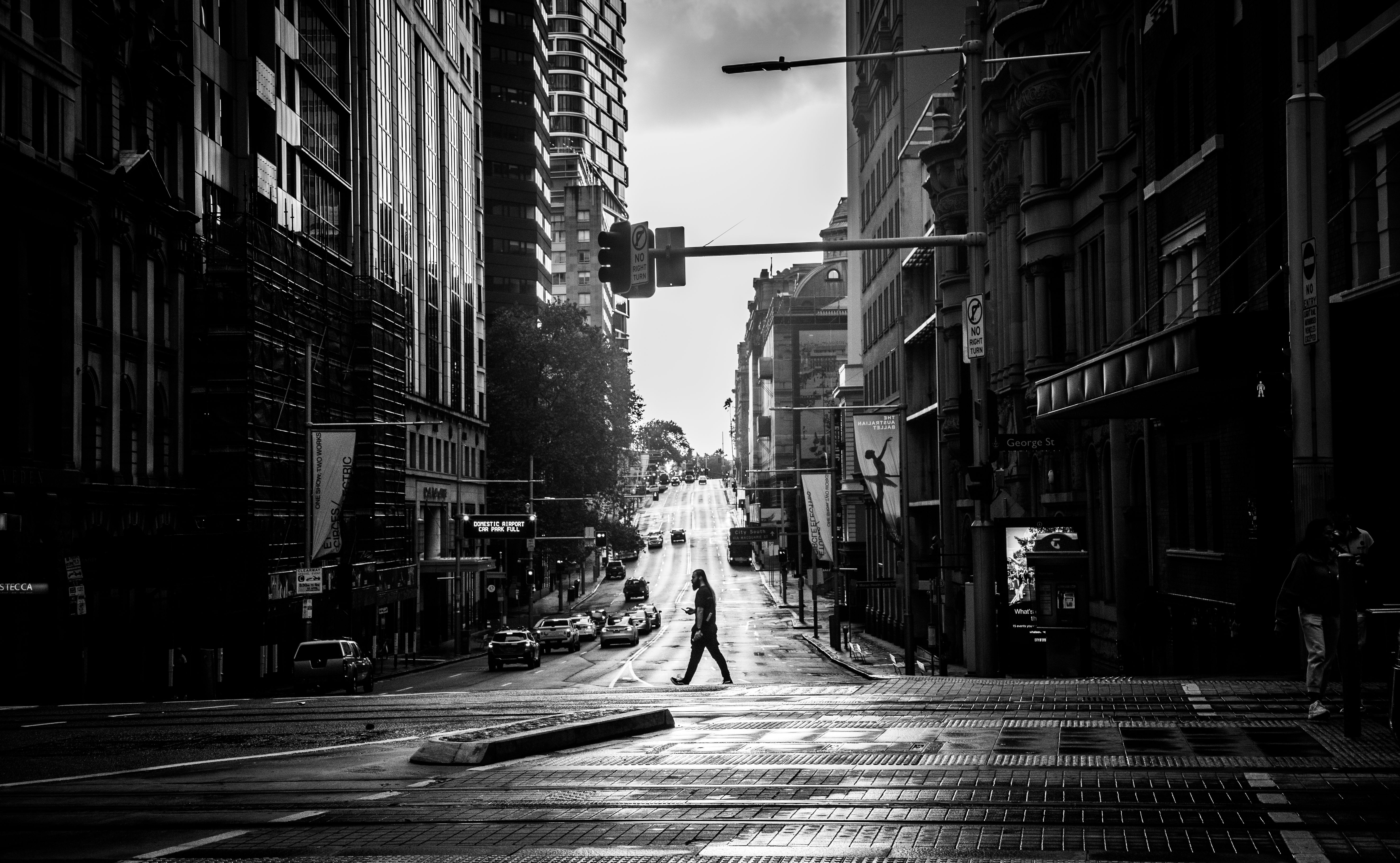 Black and White Photography of a Pedestrian Crossing a Street · Free ...