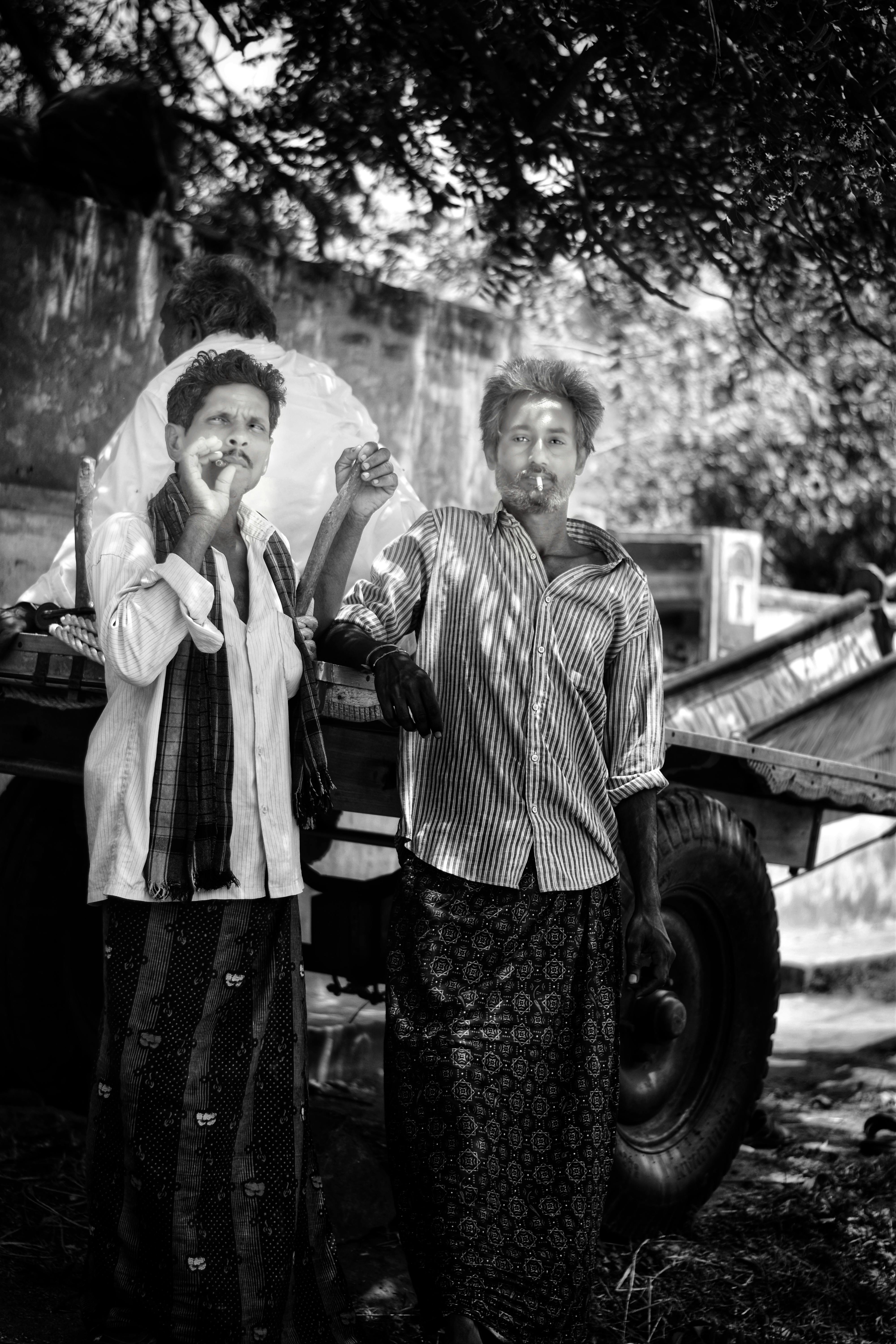 Grayscale Photography of Two Men Standing Under Tree Smoking · Free ...