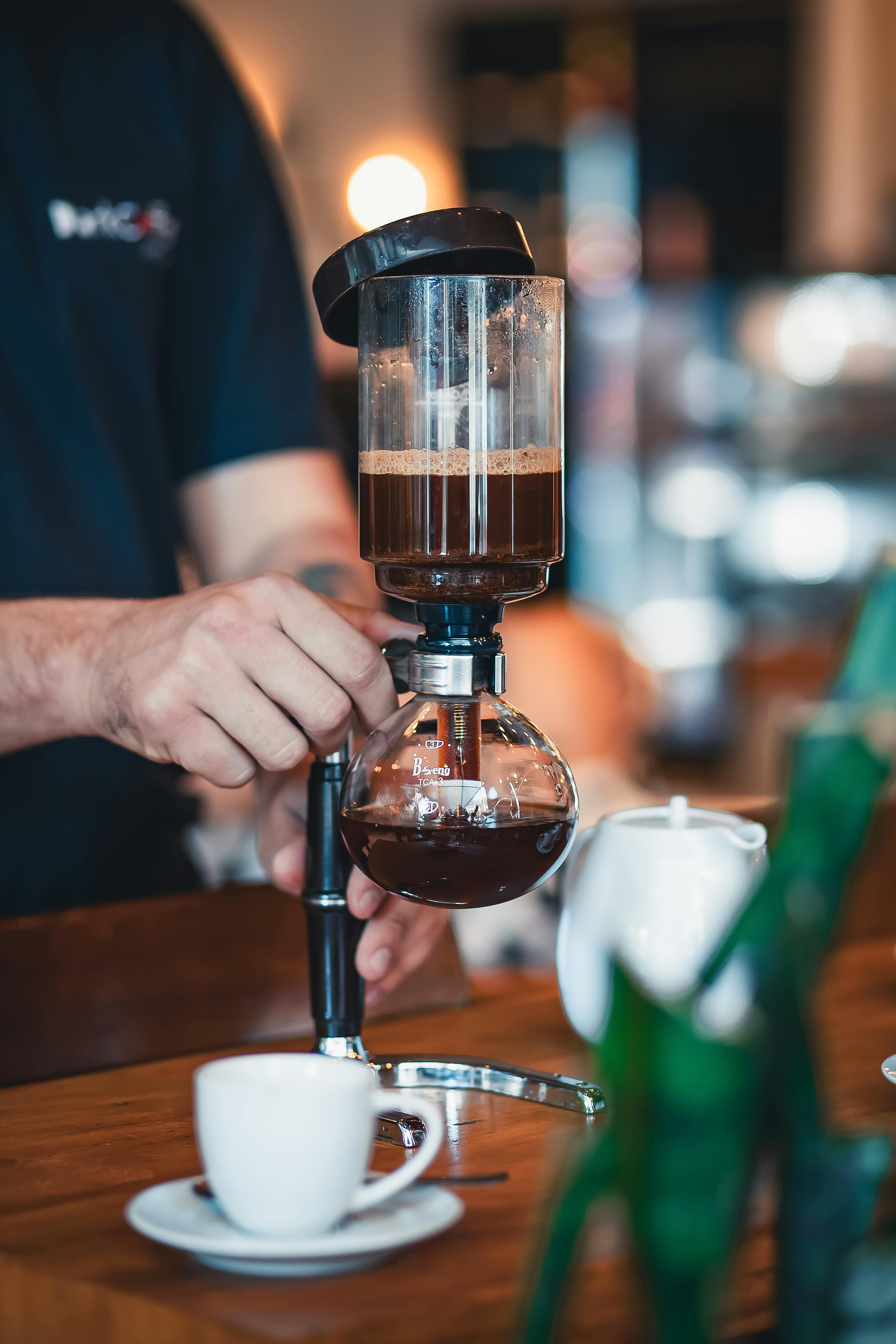 Man Preparing Coffee at Cafe · Free Stock Photo