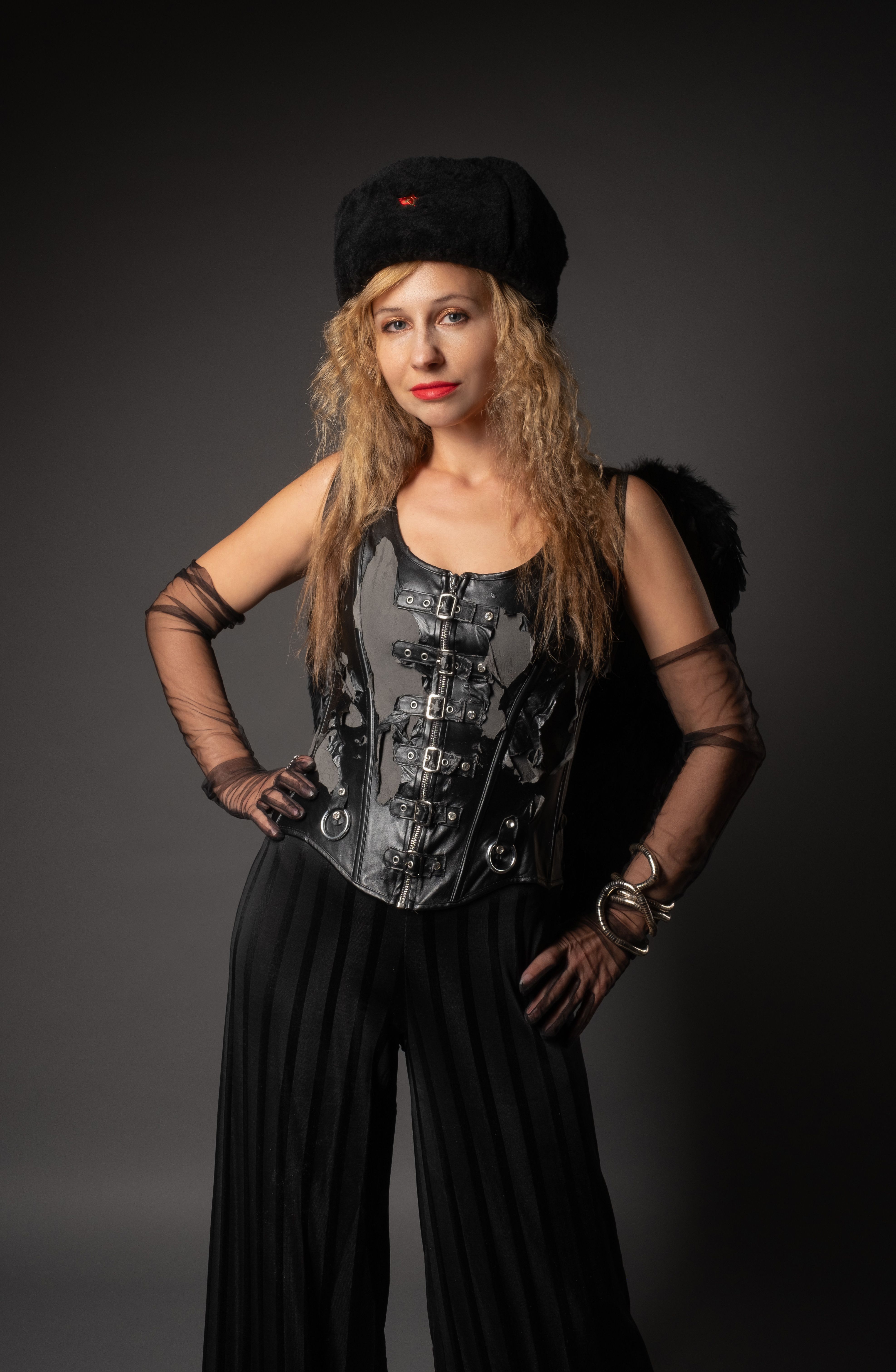 Female Model Wearing Wings, a Corset and an Ushanka · Free Stock Photo