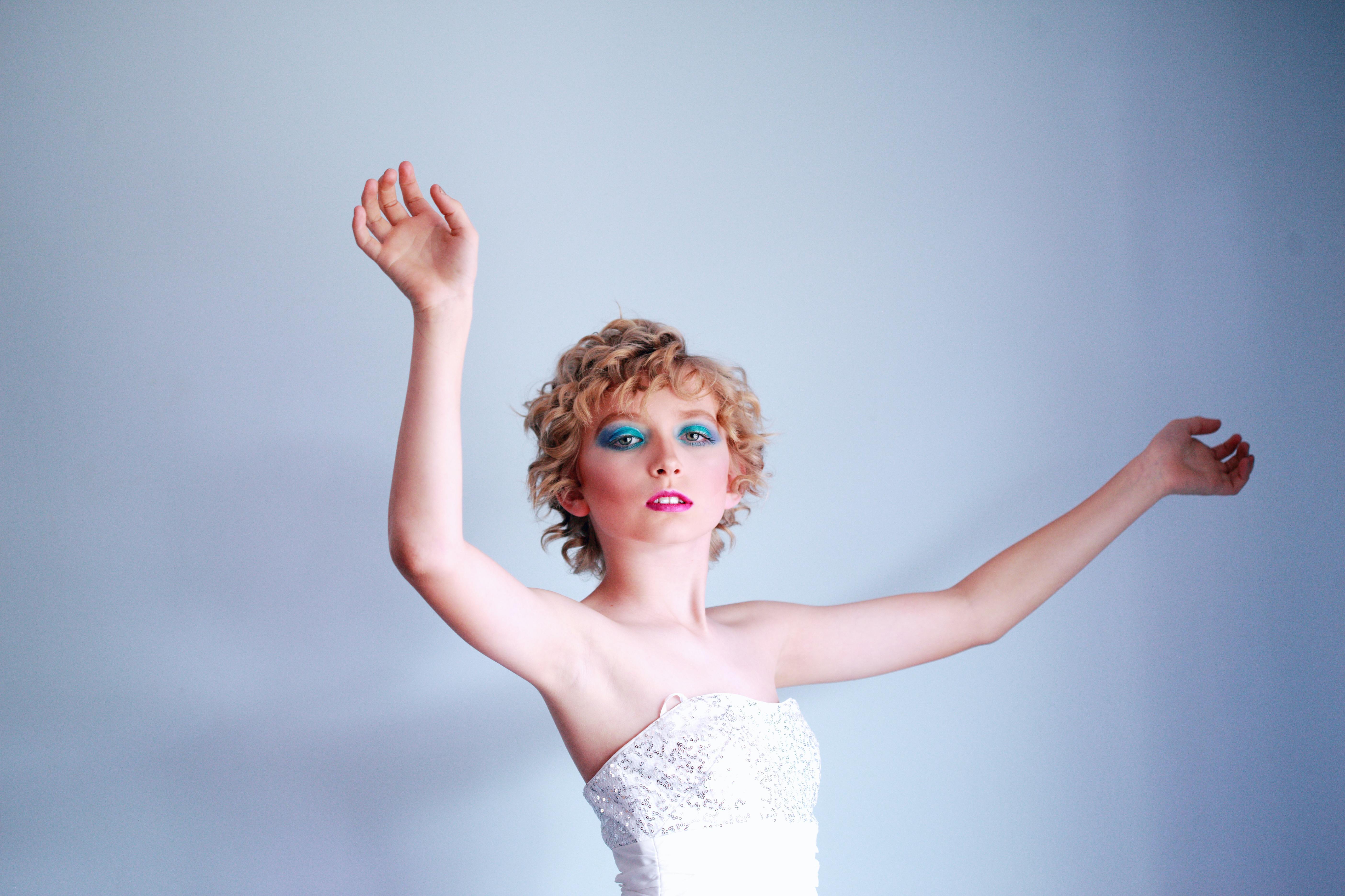 Photo of Girl Raising Her Hands · Free Stock Photo