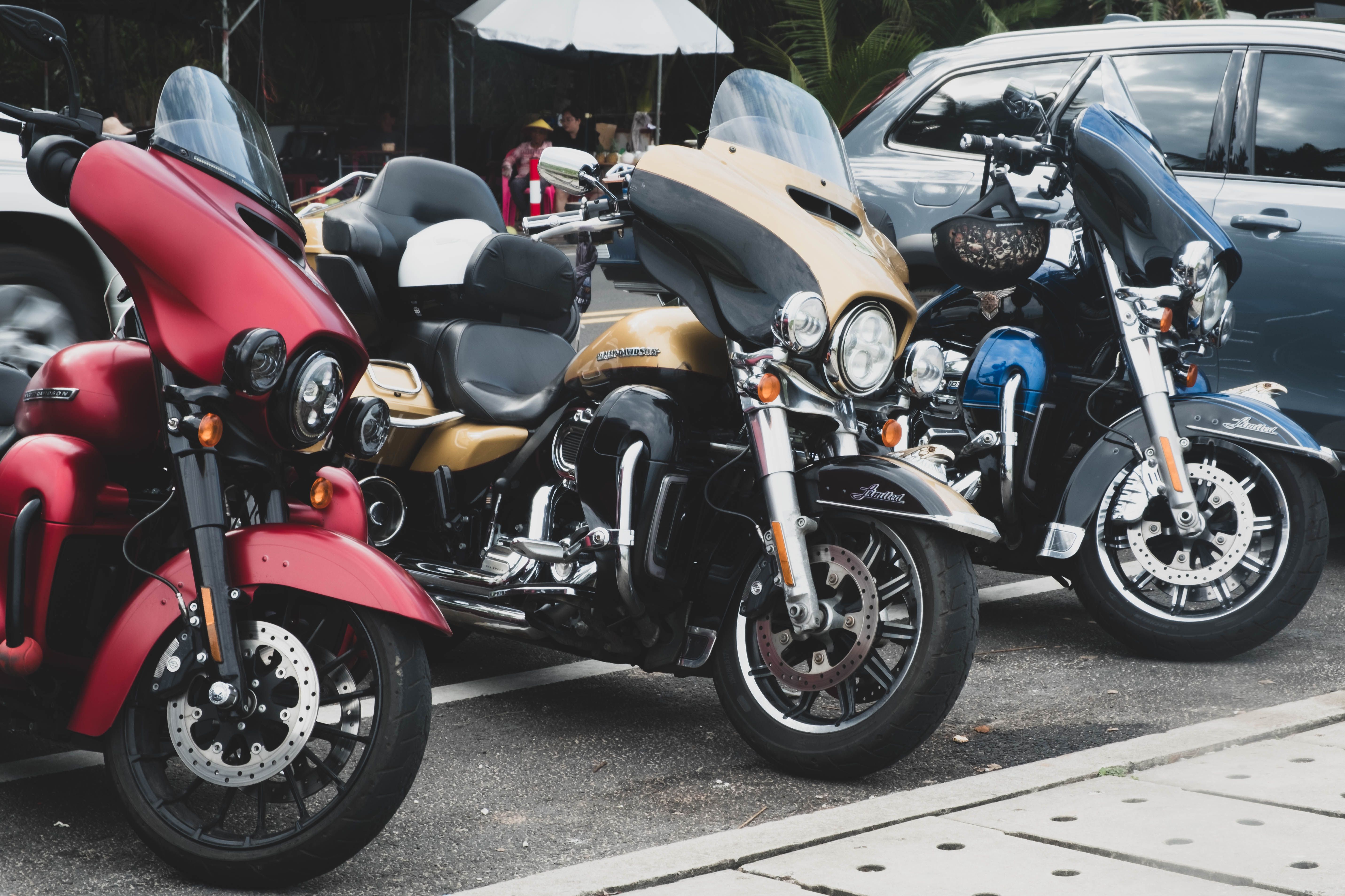 Motorcycles Parked along a Street · Free Stock Photo