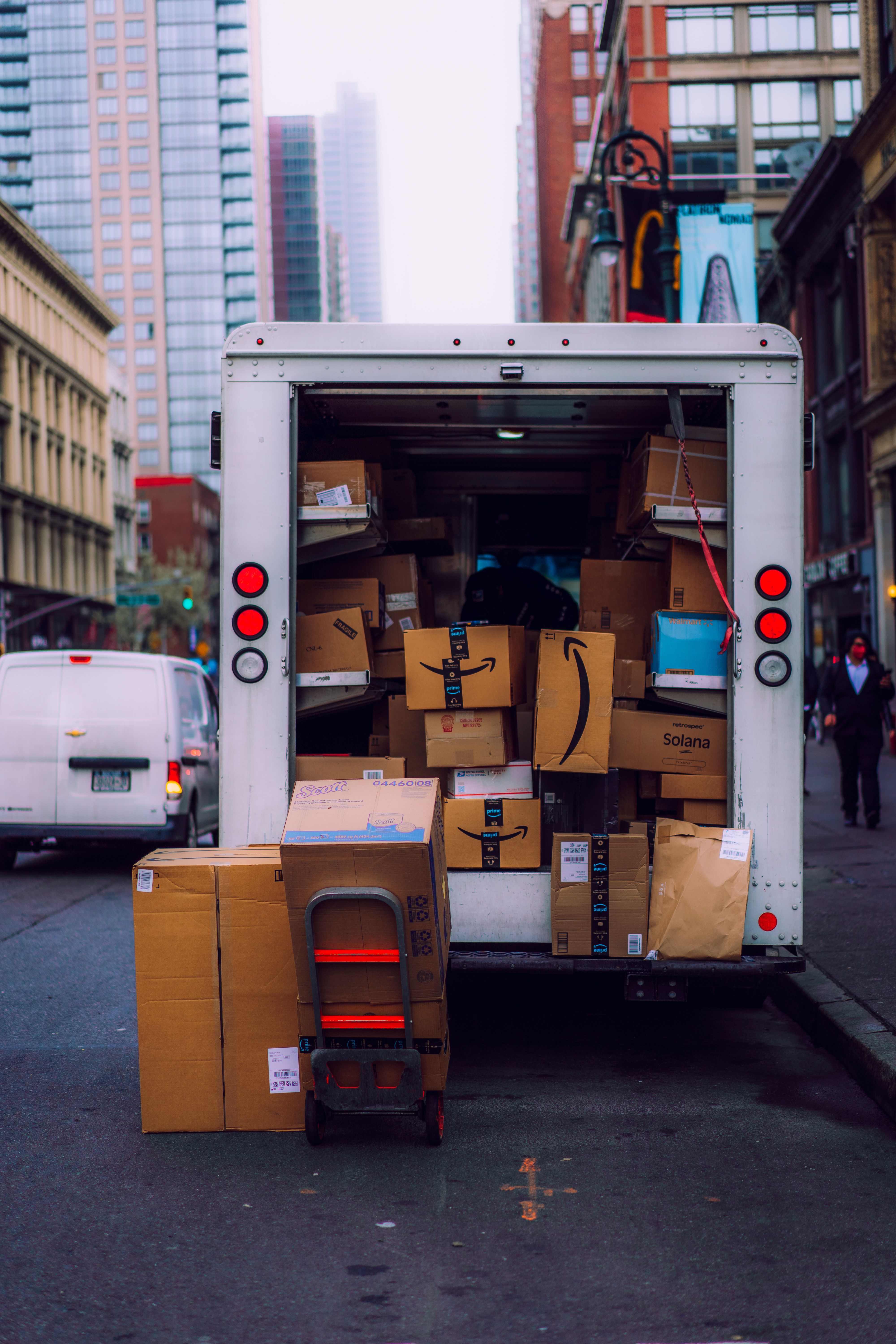 A truck with boxes on the side of the road · Free Stock Photo