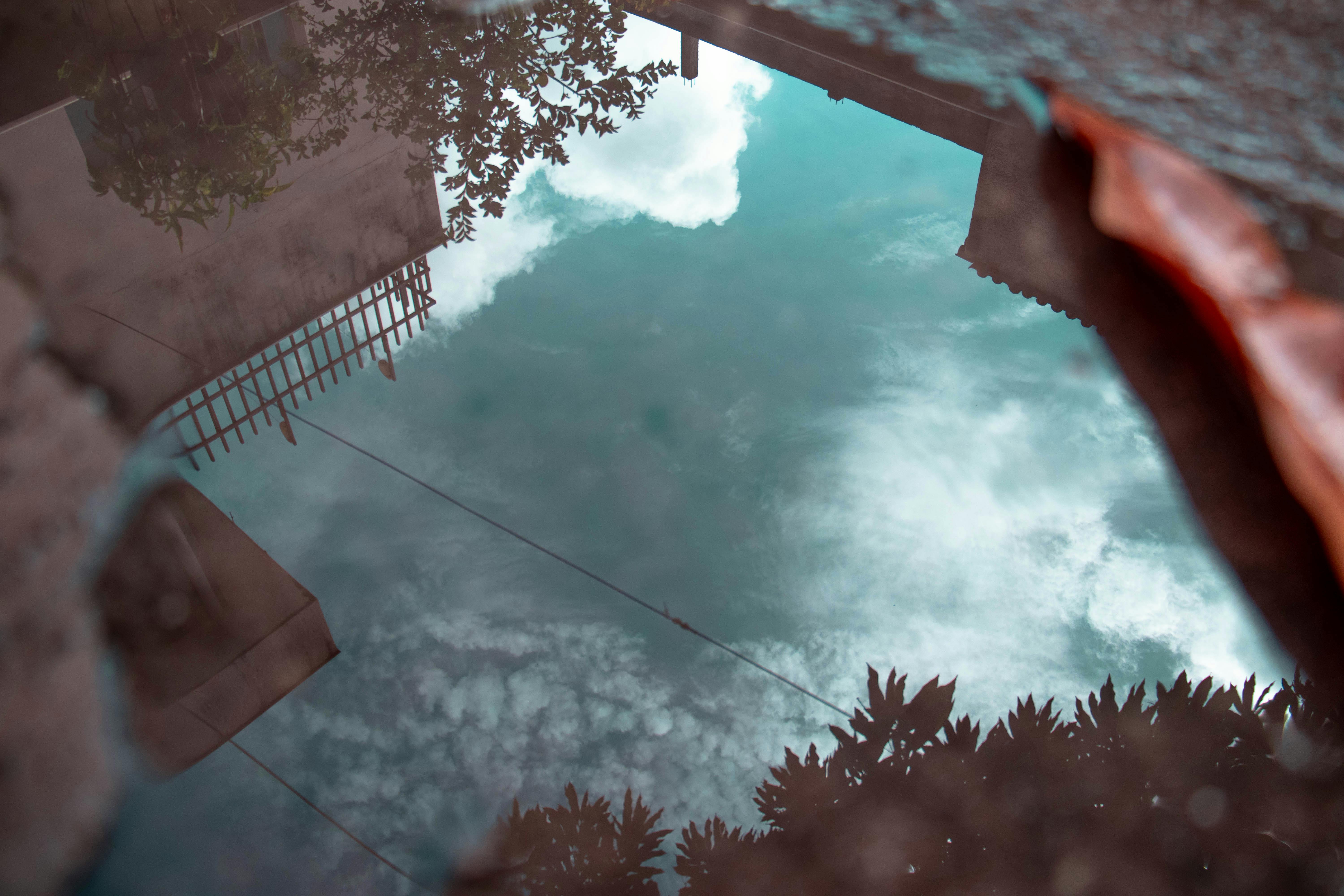 Reflection Of Sky From Puddle · Free Stock Photo
