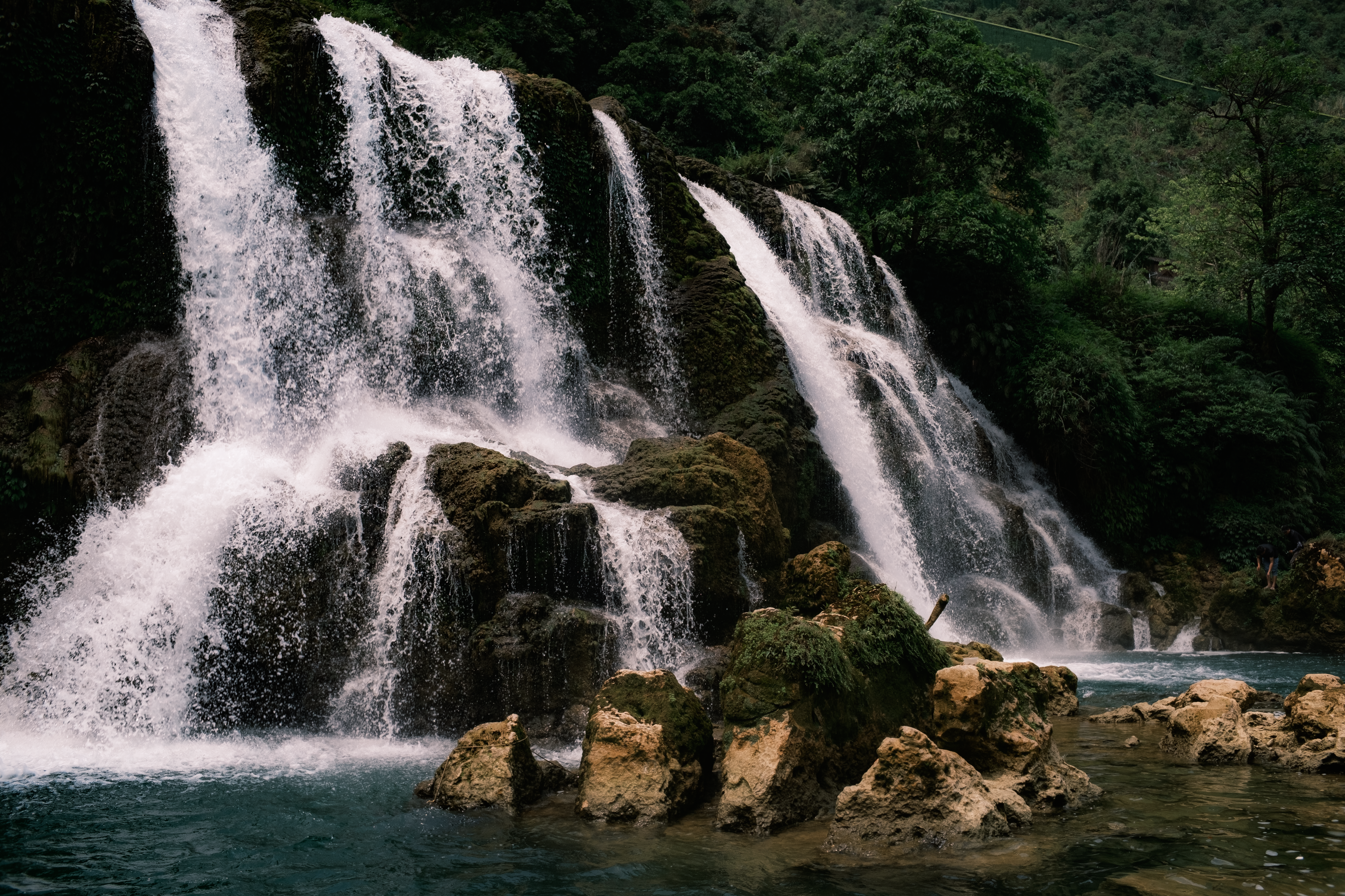 Rocks in Front of a Waterfall · Free Stock Photo