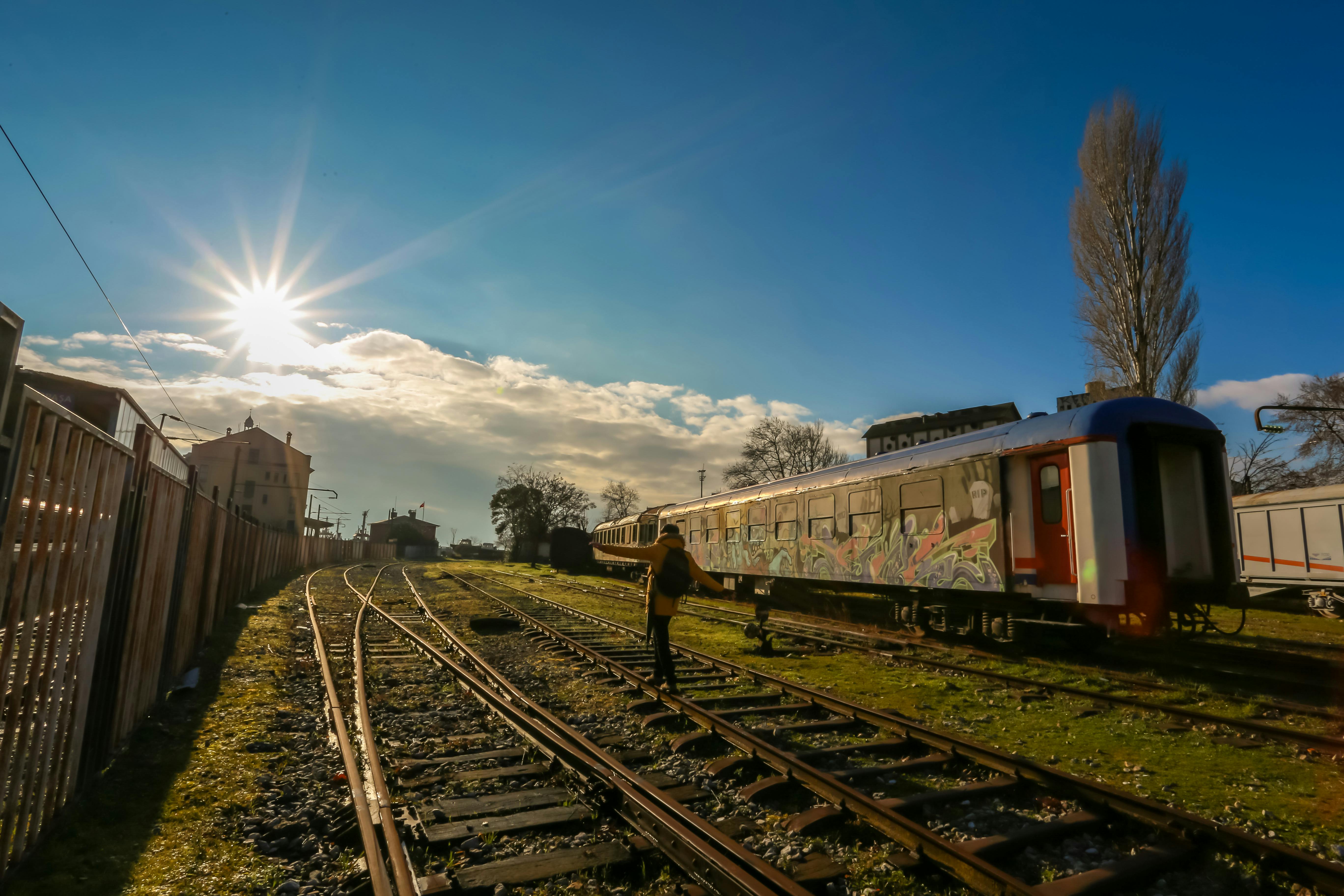 Two Black-and-yellow Trains at Daytime · Free Stock Photo