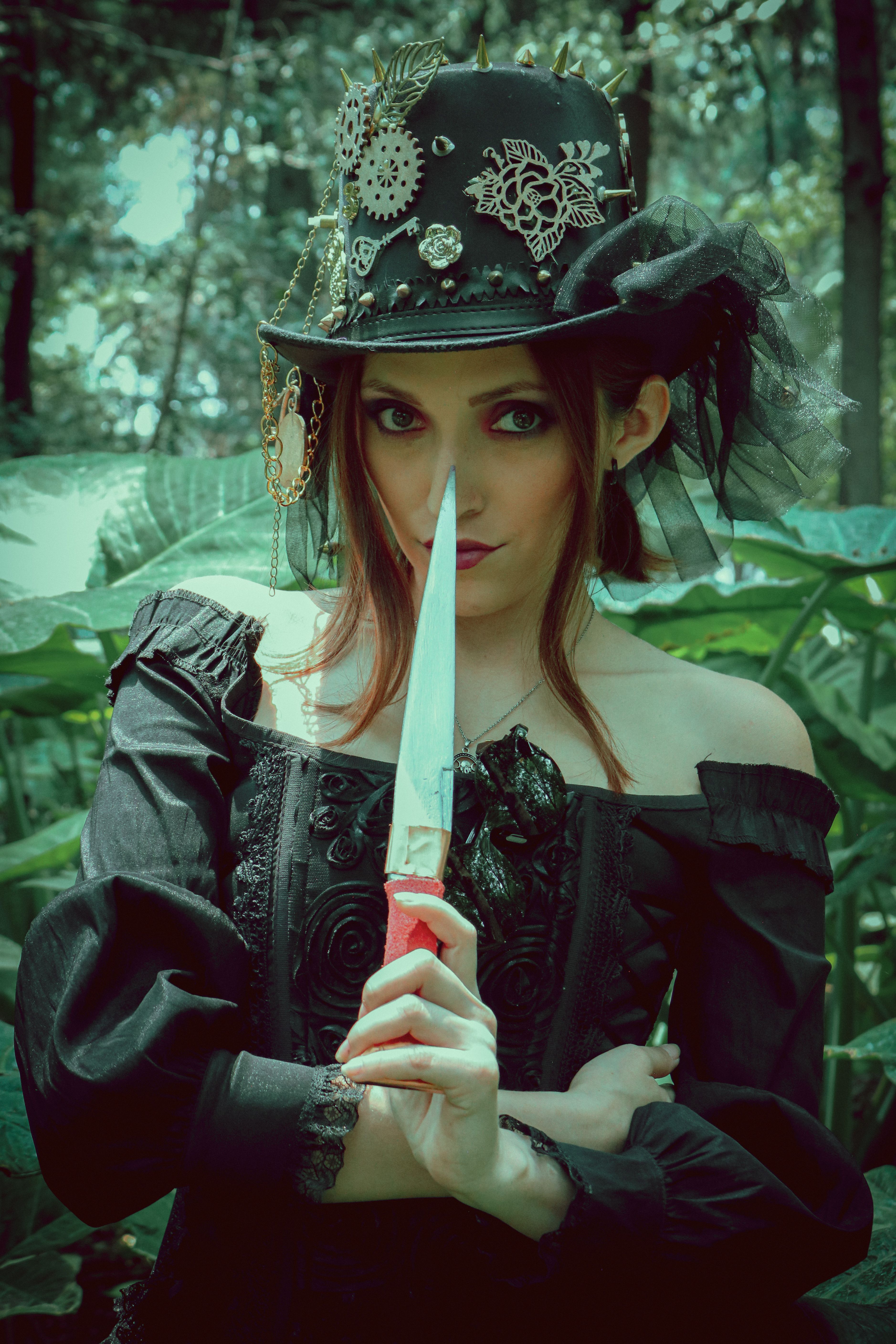 Portrait of Woman in Dress, Hat and with Knife · Free Stock Photo