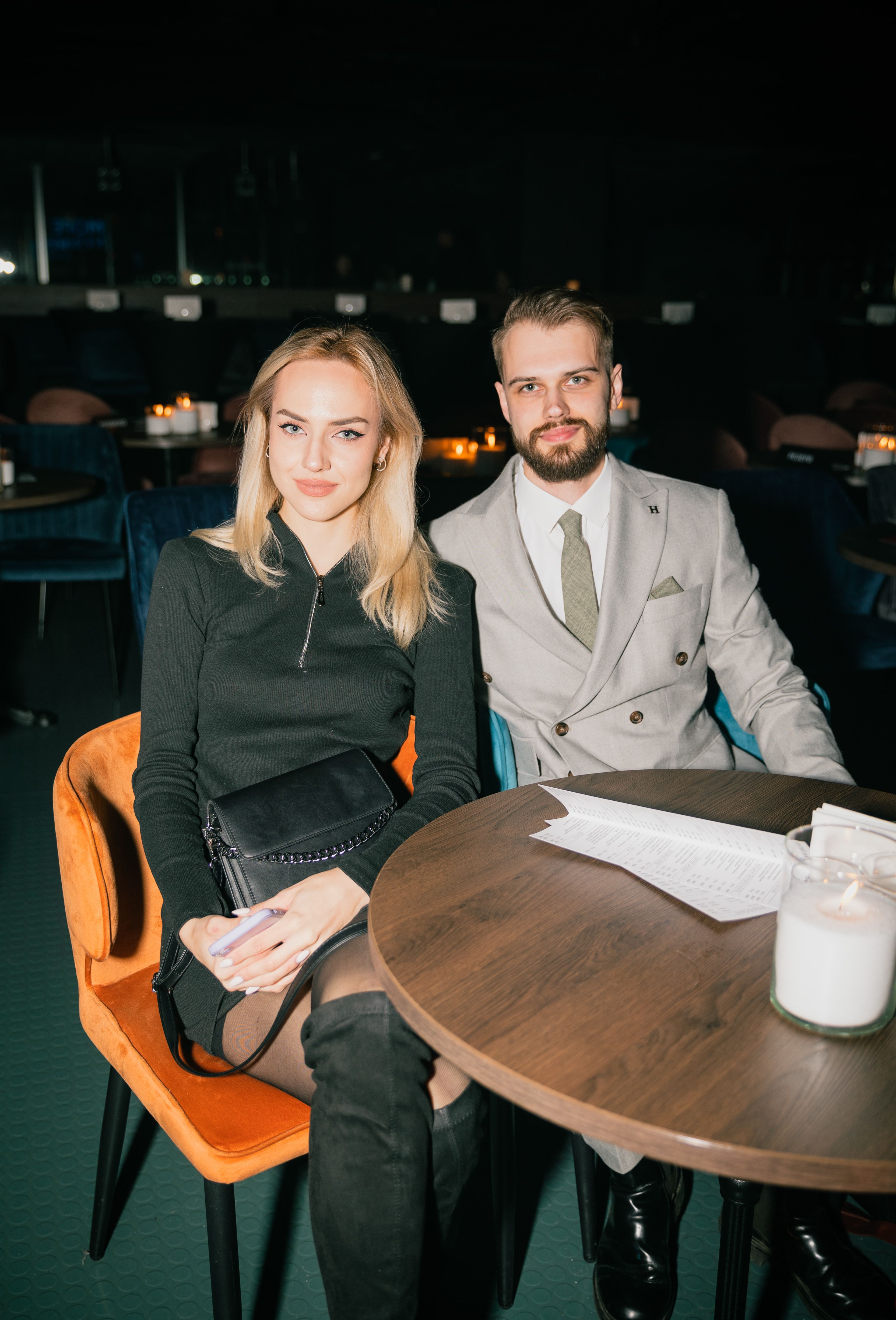 Elegant Couple Sitting Together at Table in Restaurant · Free Stock Photo