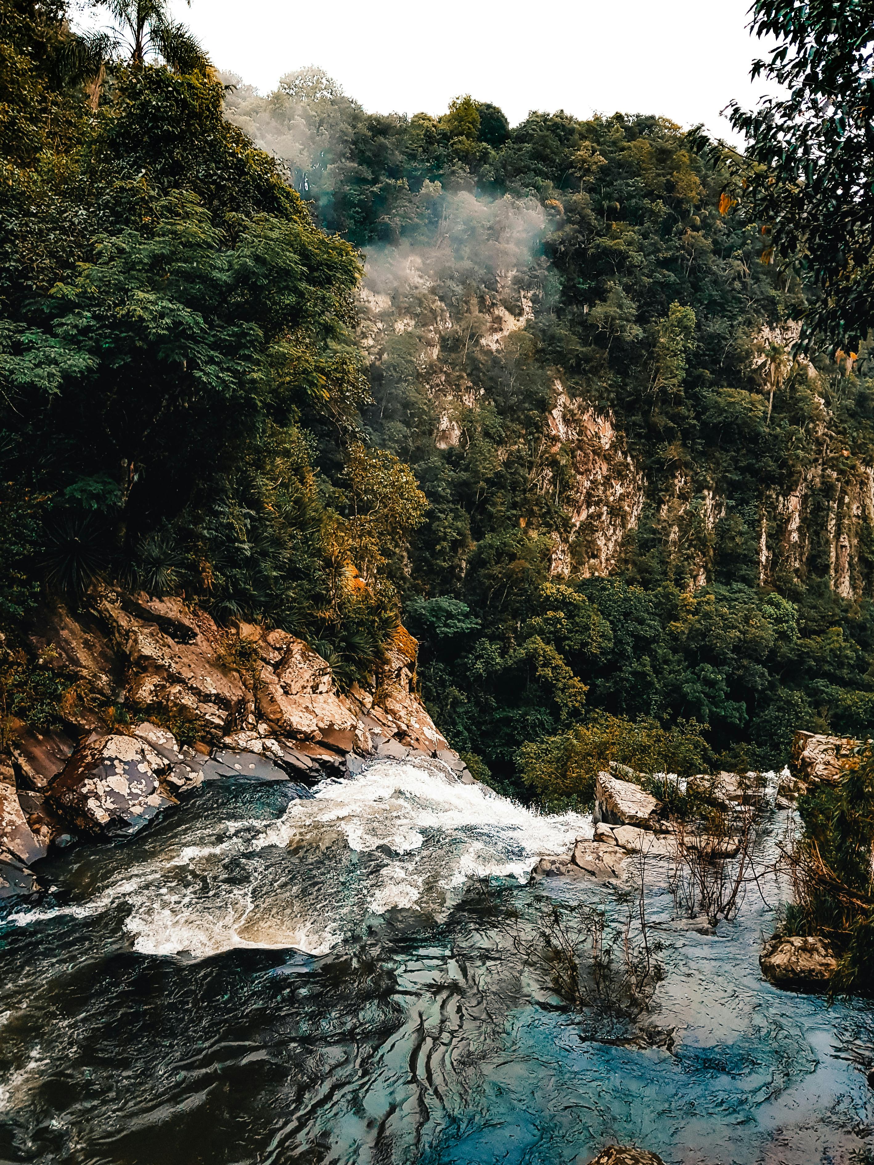 River in Between Mountains · Free Stock Photo