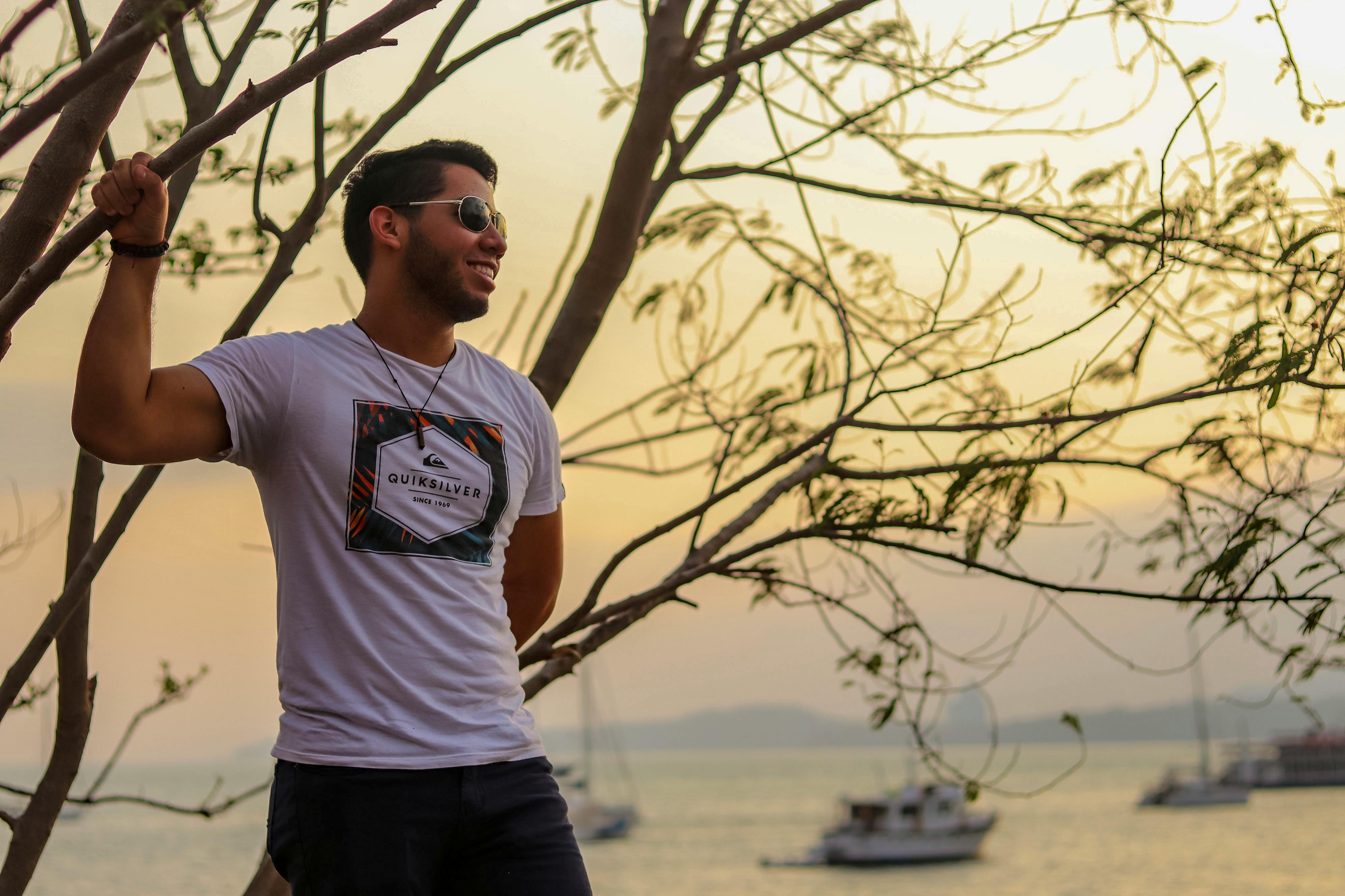 Man Standing Beside Tree · Free Stock Photo