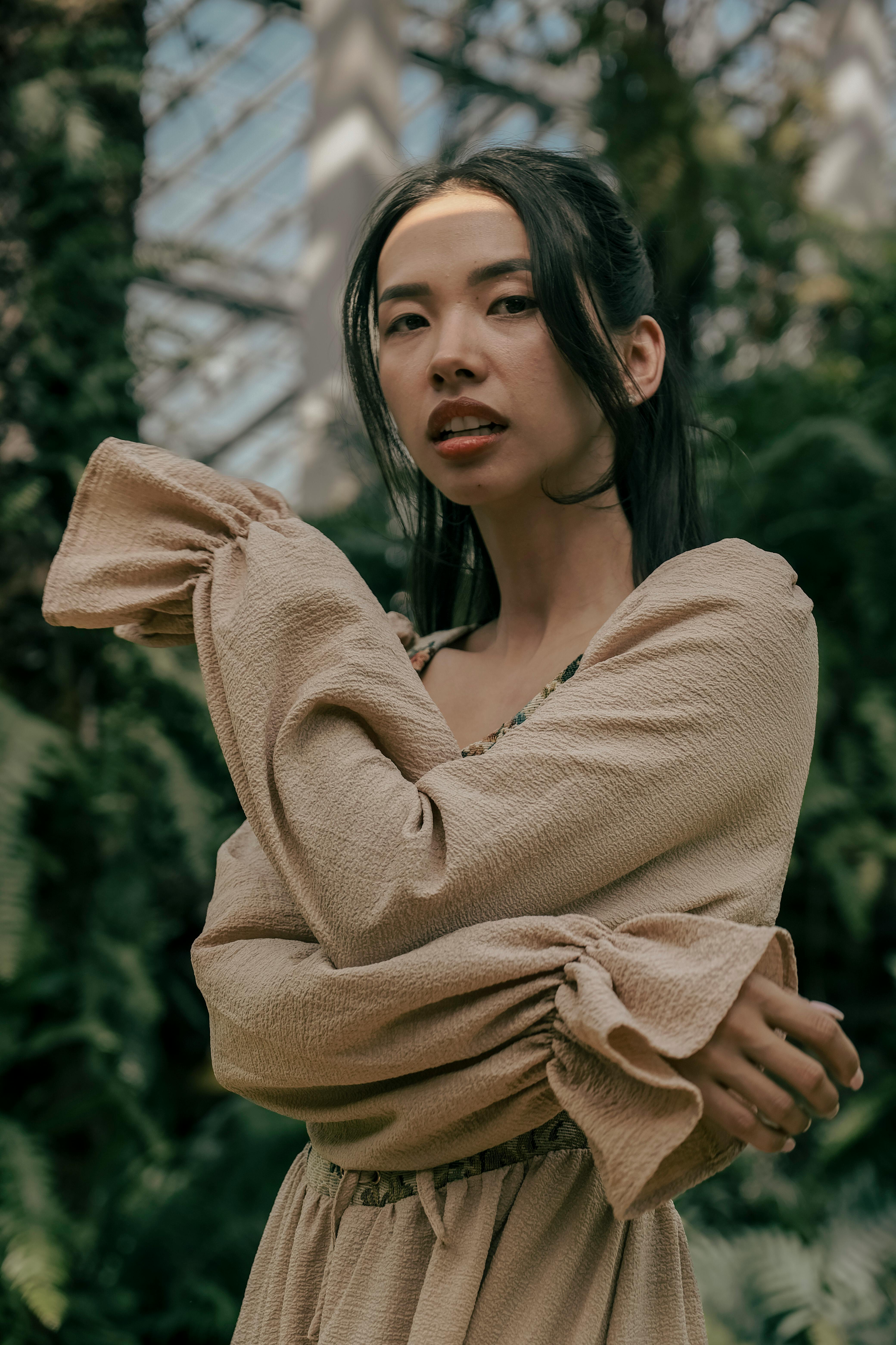 Moody cottage core model with arms posed · Free Stock Photo