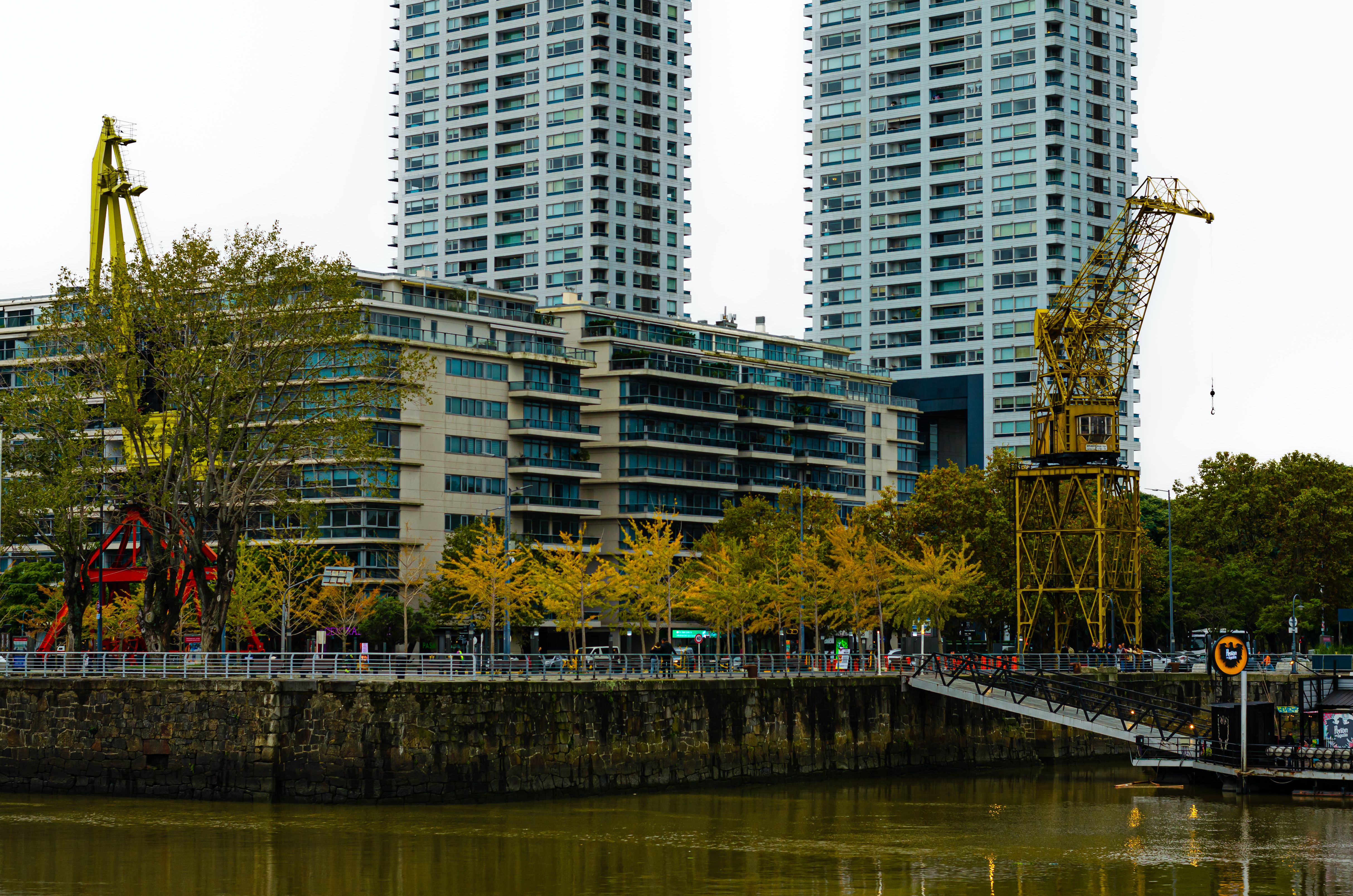 A large city with tall buildings and a river · Free Stock Photo