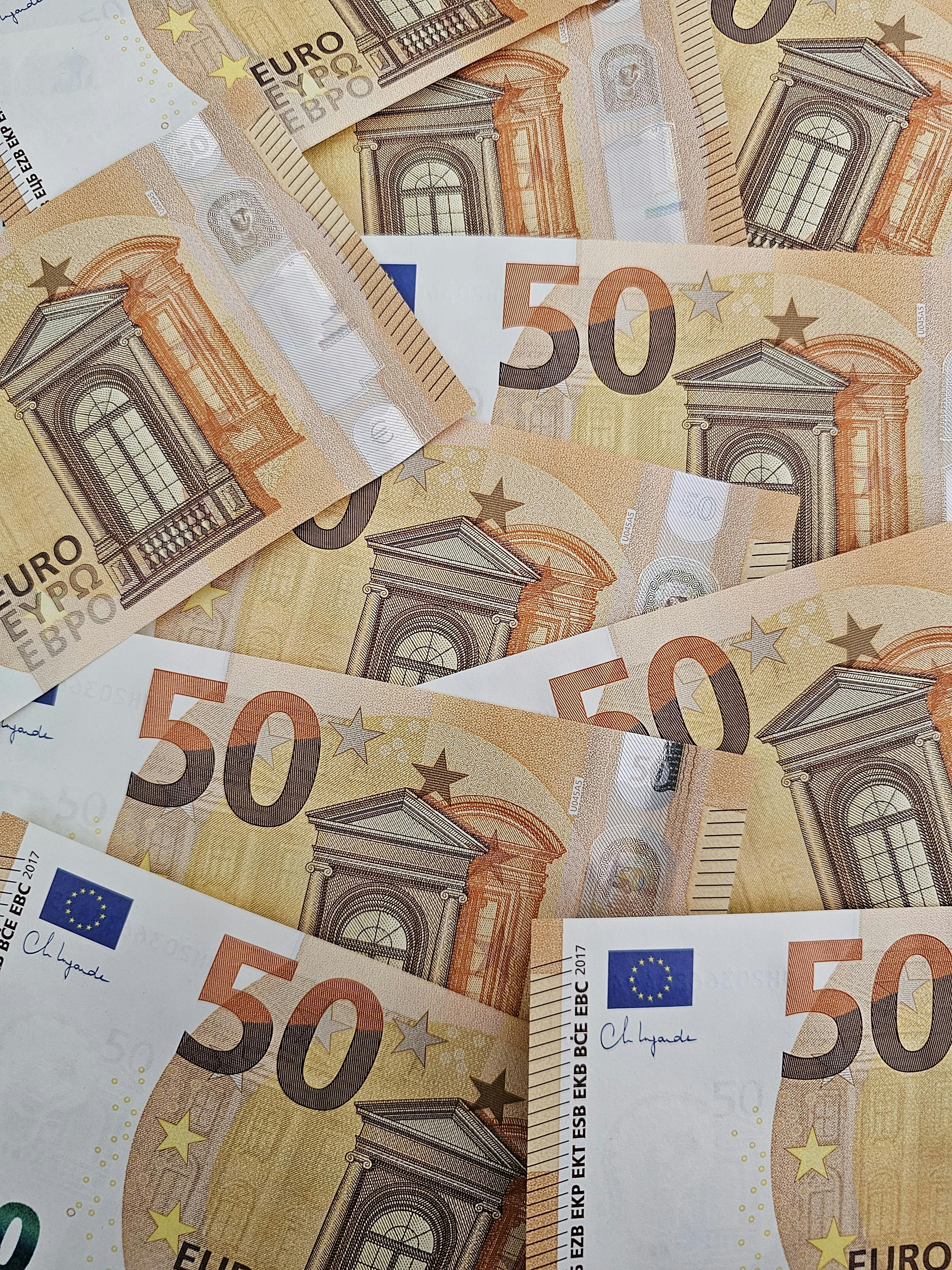 A pile of 50 euro notes with the words 50 euro · Free Stock Photo