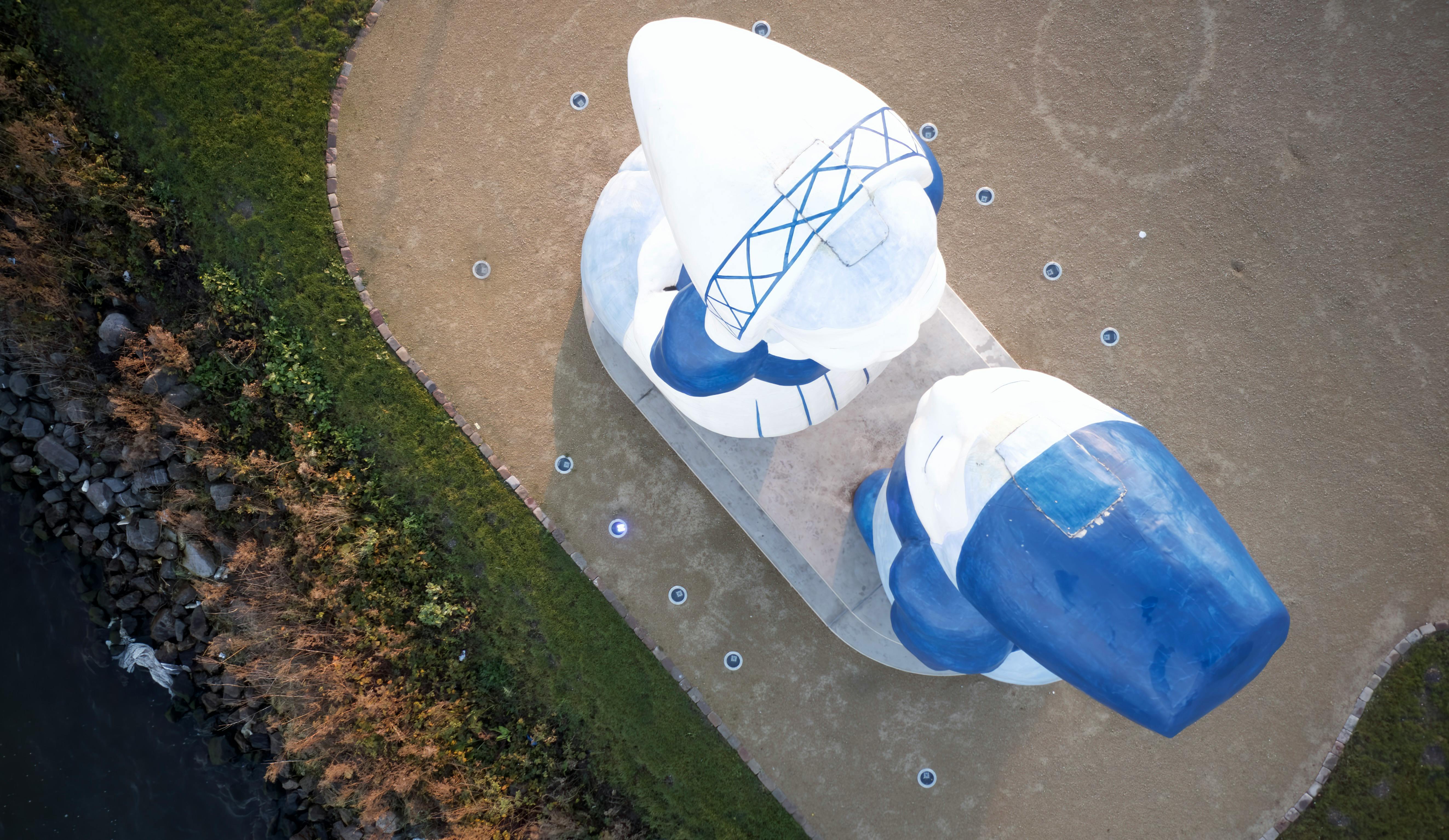An aerial view of a blue and white structure · Free Stock Photo