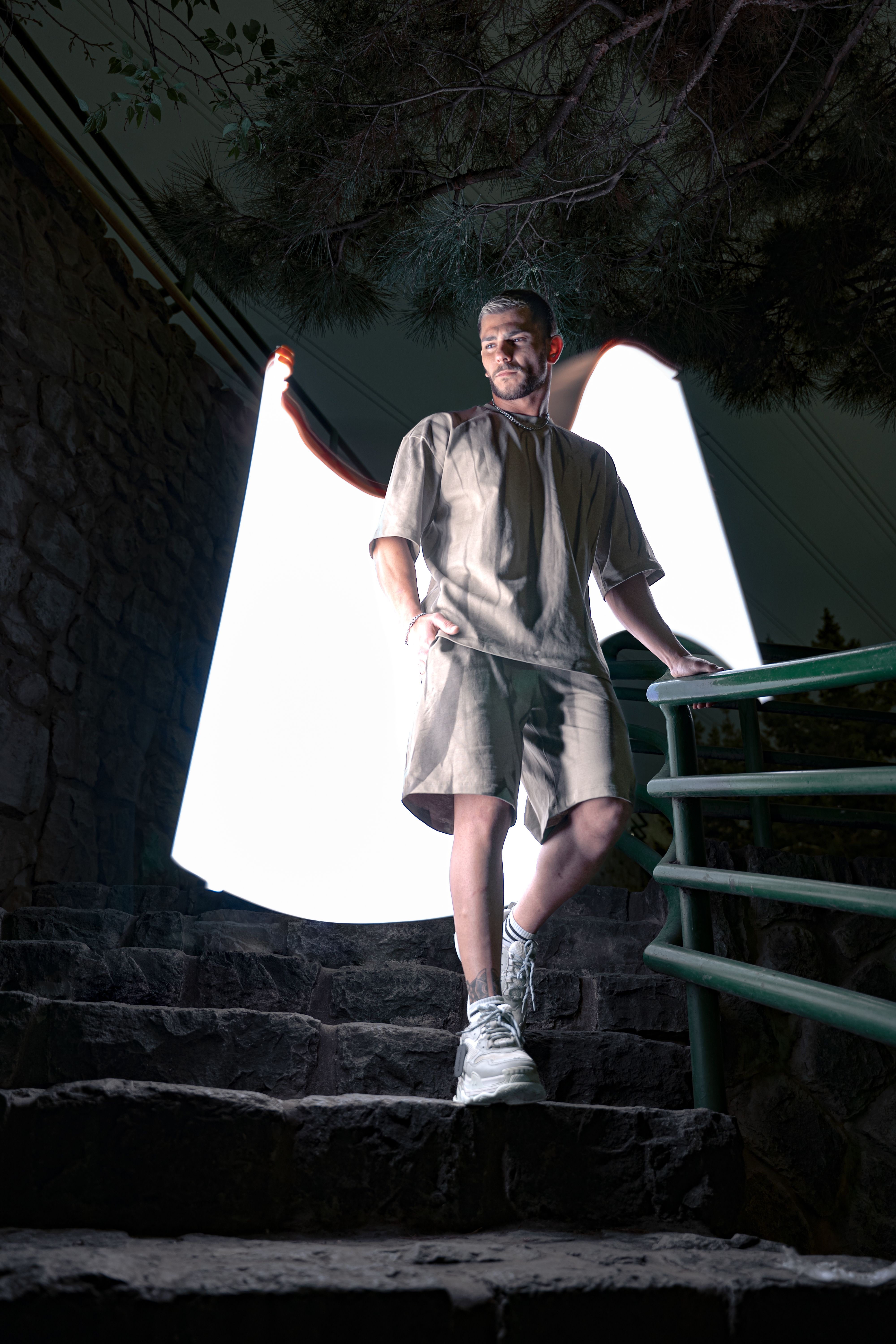 Man in Shorts Posing on Steps · Free Stock Photo