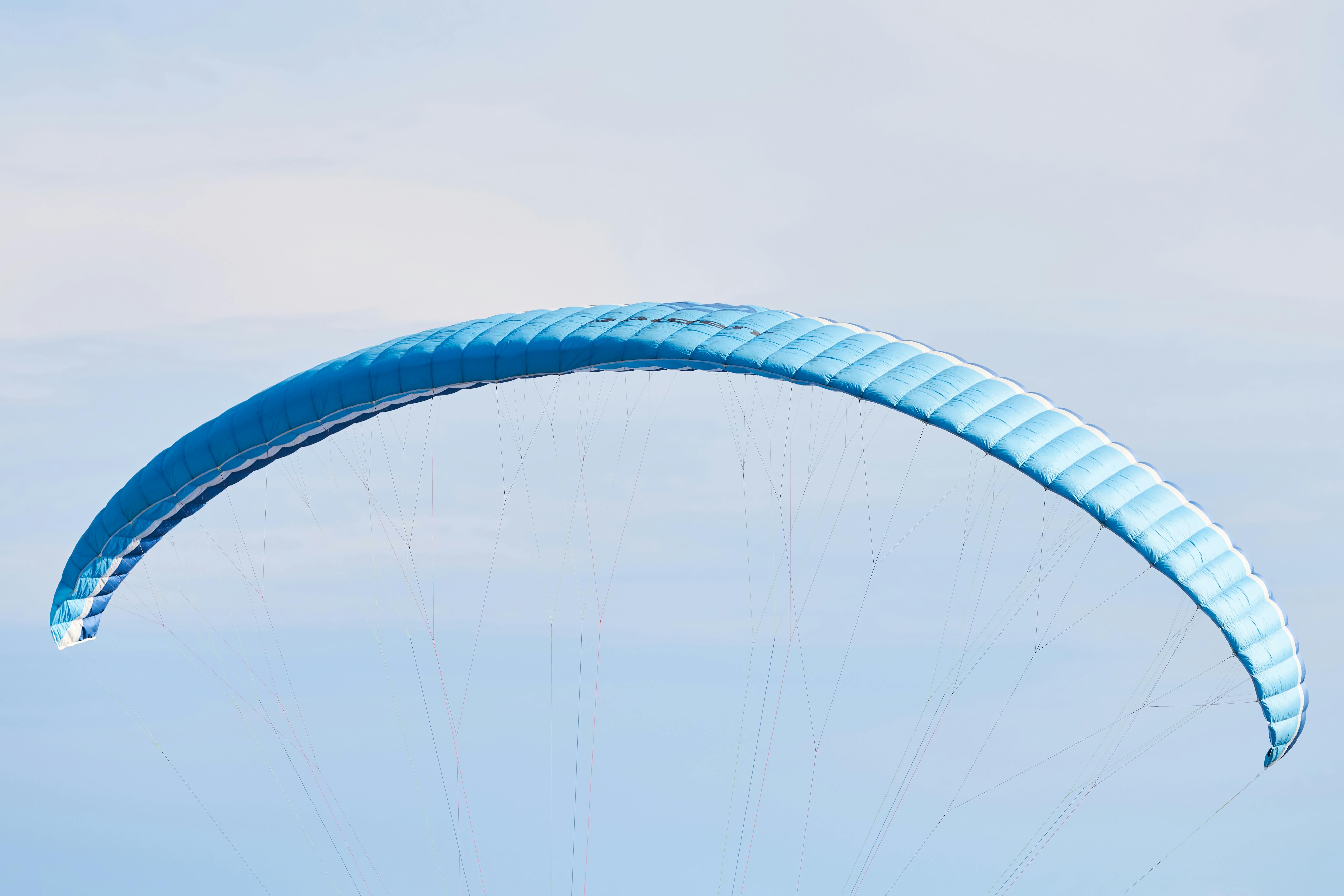 Blue Gliding Parachute · Free Stock Photo