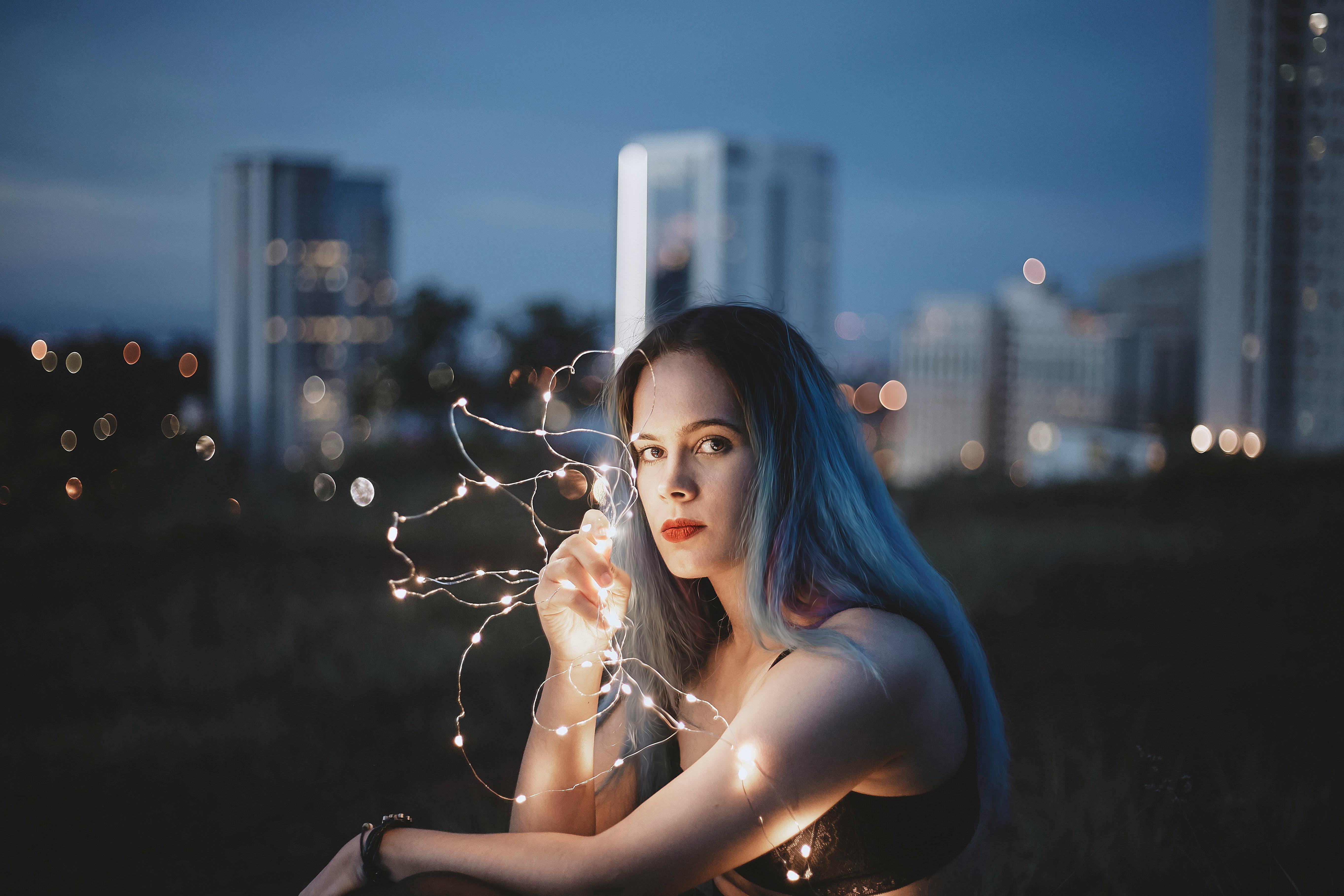 Woman Holding String Lights · Free Stock Photo