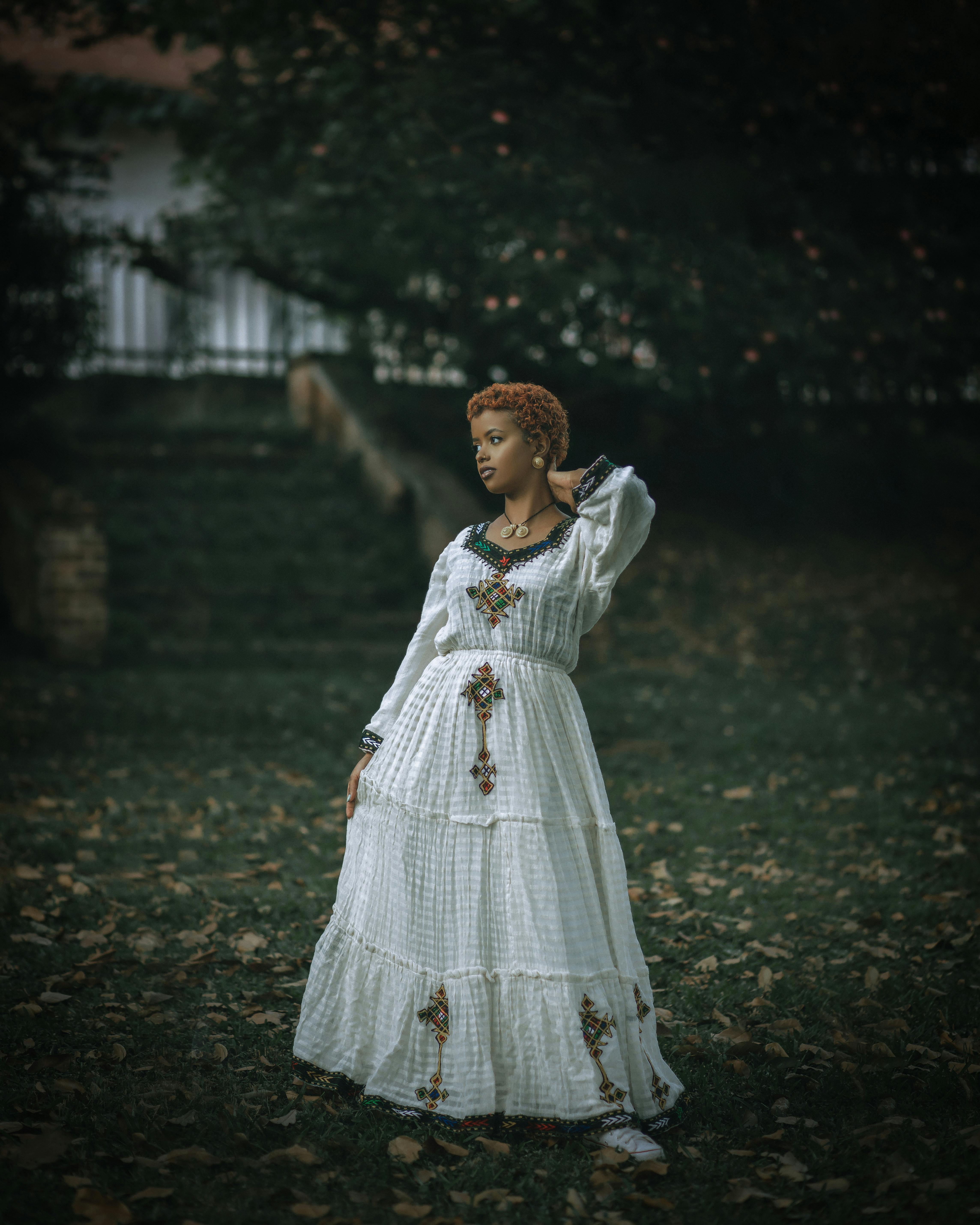 Woman in Rustic White Dress Posing in Garden · Free Stock Photo
