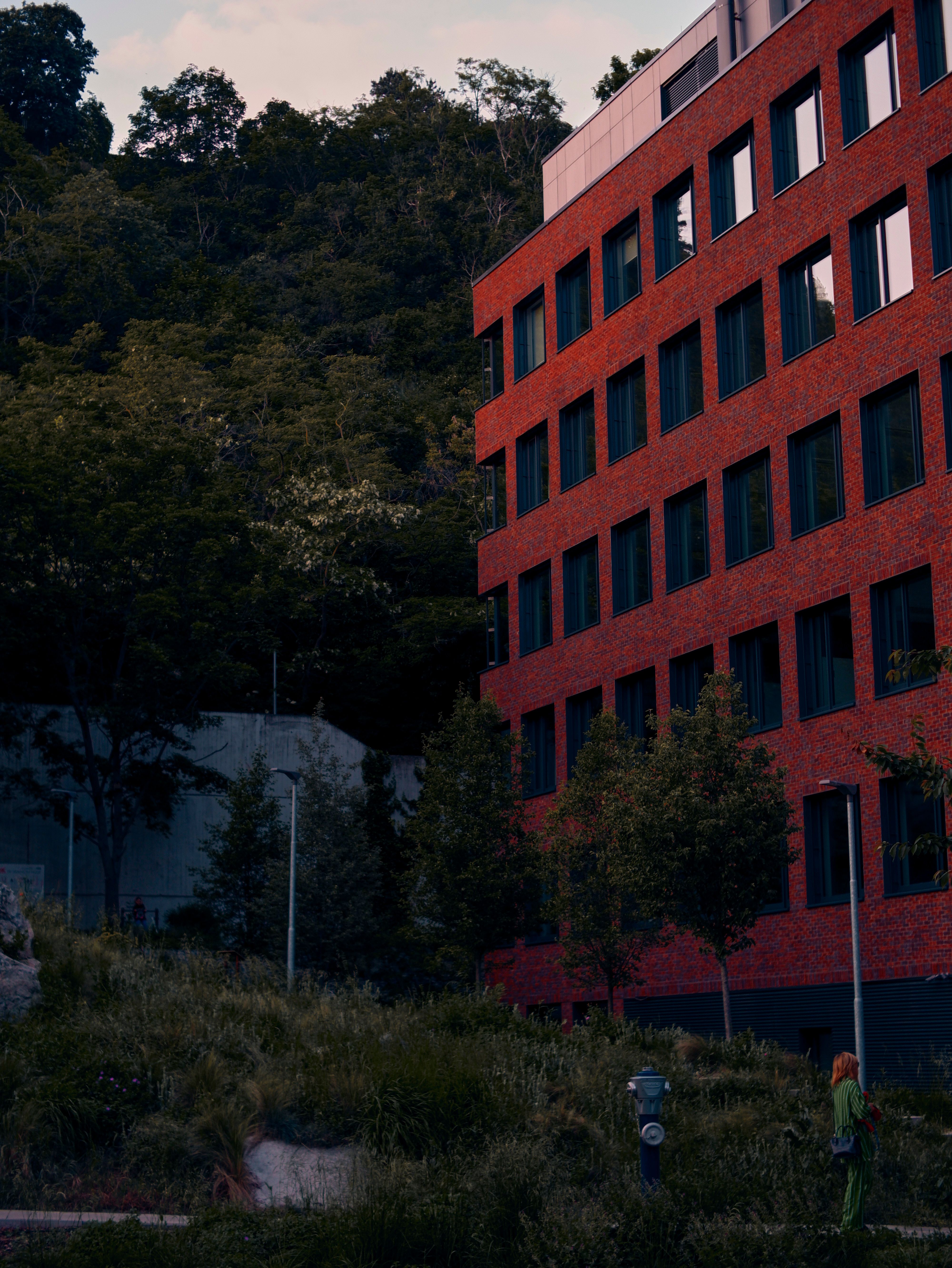Red Modern Building by Park in City · Free Stock Photo