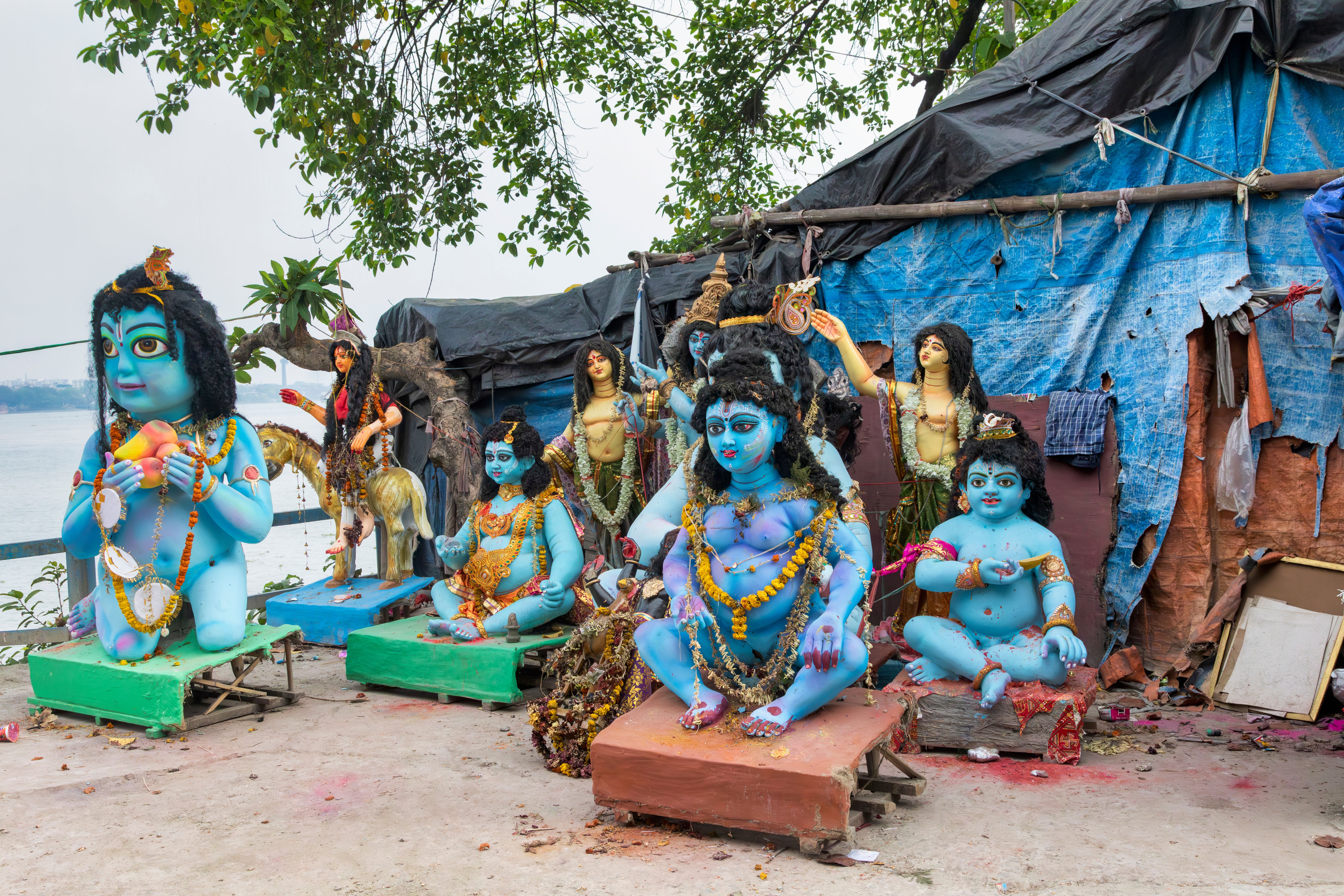 Religious Sculptures of Deities Standing in Front of an Old Hut · Free ...