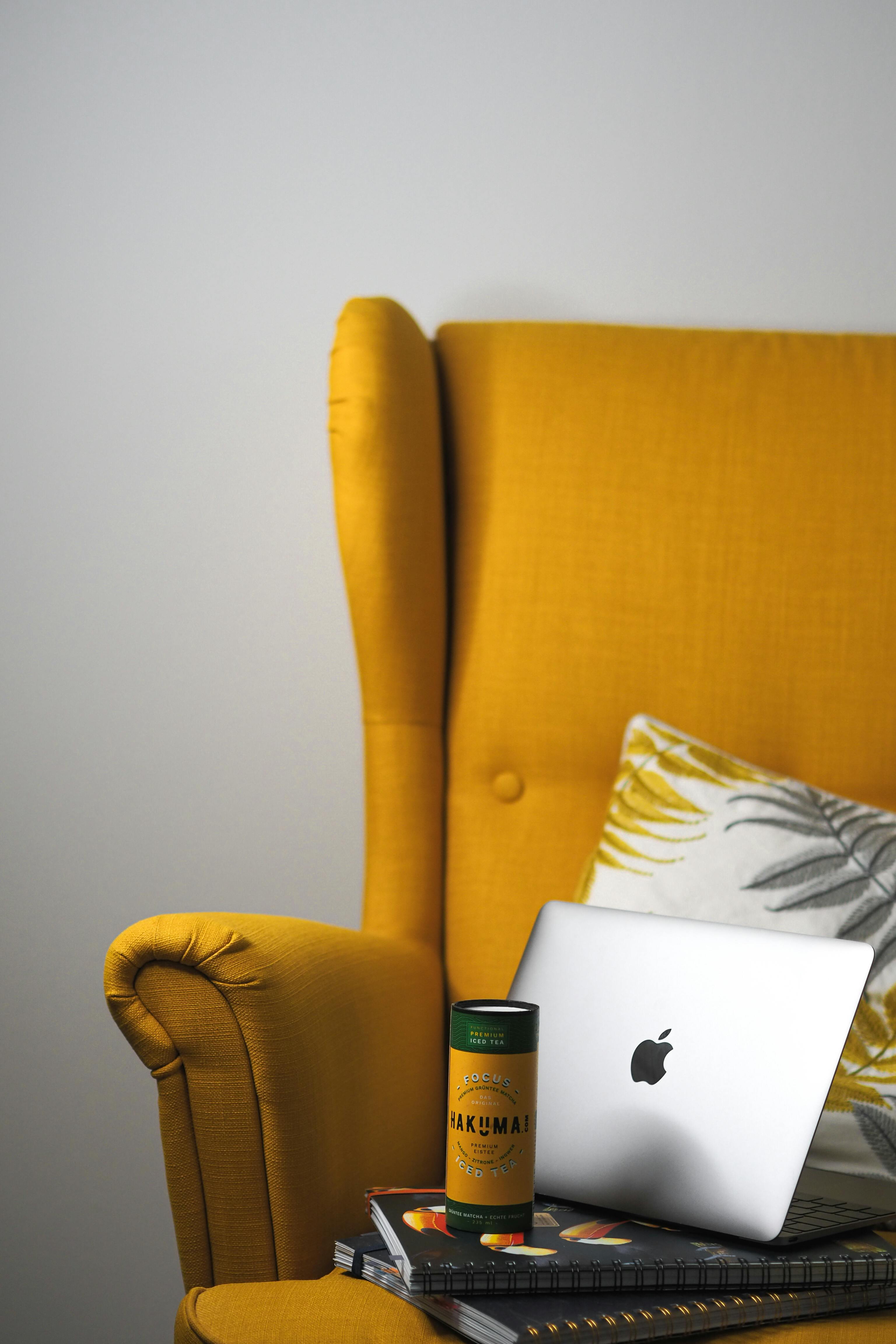 Cozy bed with laptop and notebook · Free Stock Photo