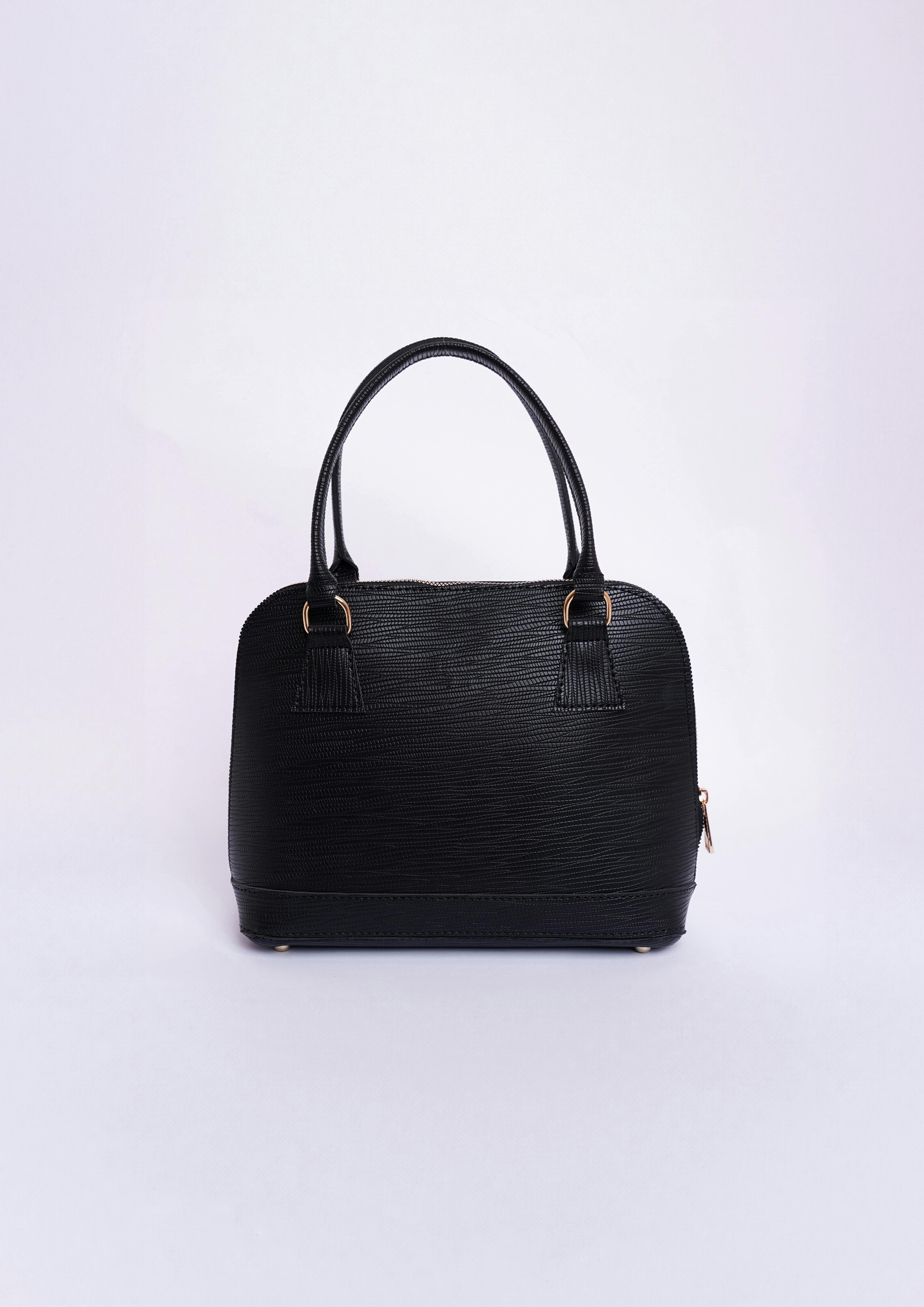 Brown and Black Leather Bags in Close-Up Photography · Free Stock Photo