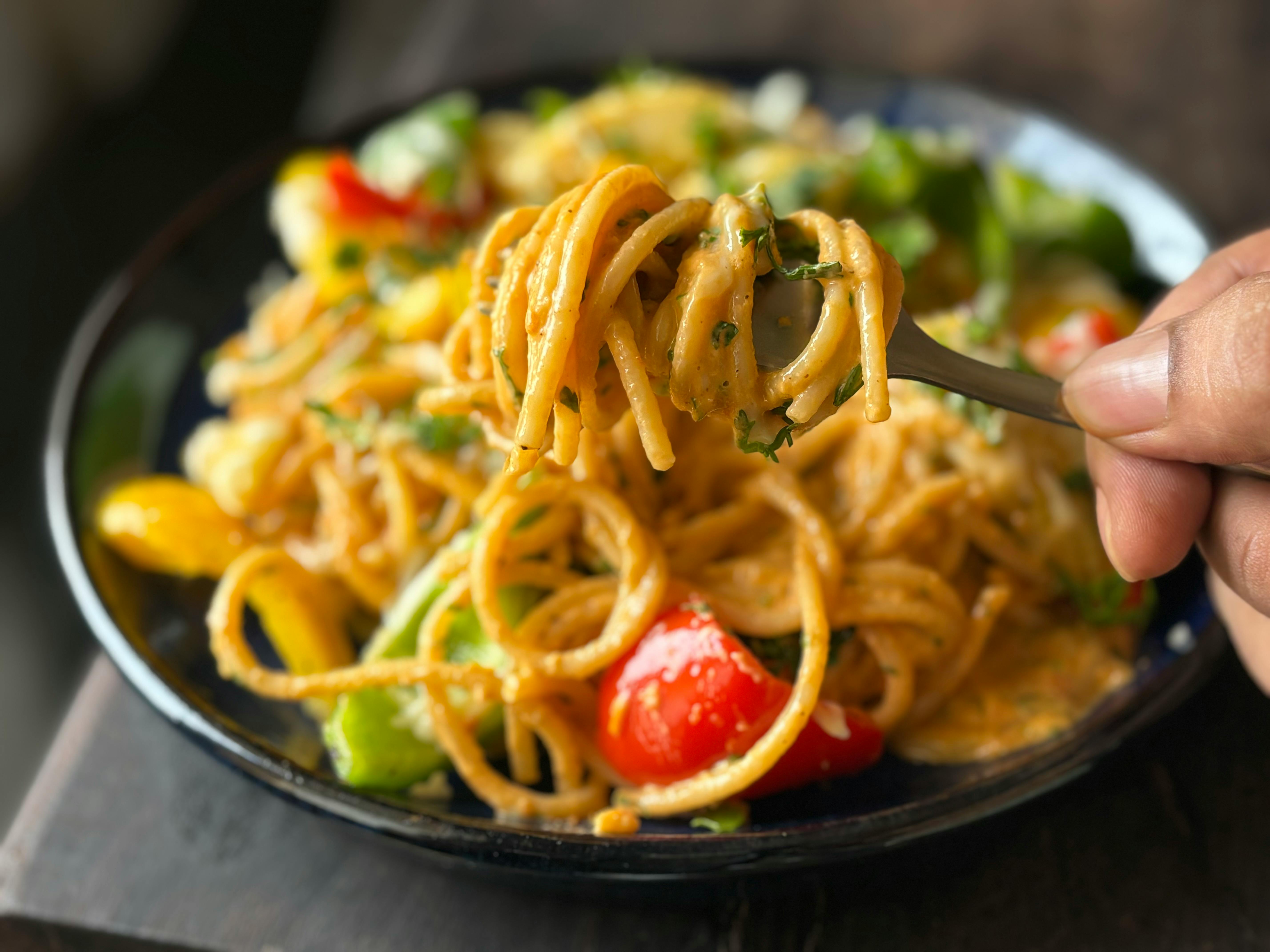 Pasta with flowers laying on plate · Free Stock Photo