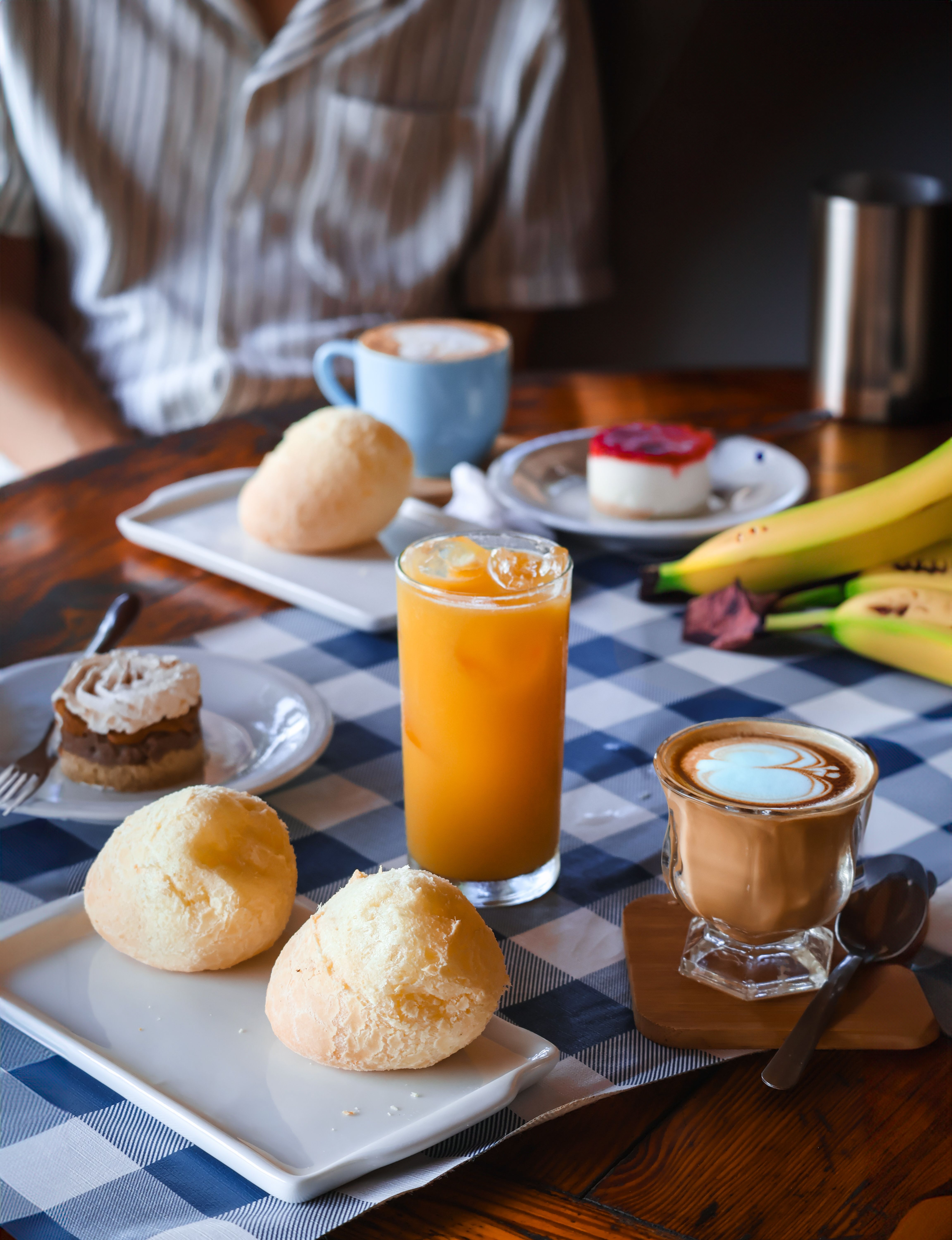Bread Buns with Juice and Coffee on Table · Free Stock Photo