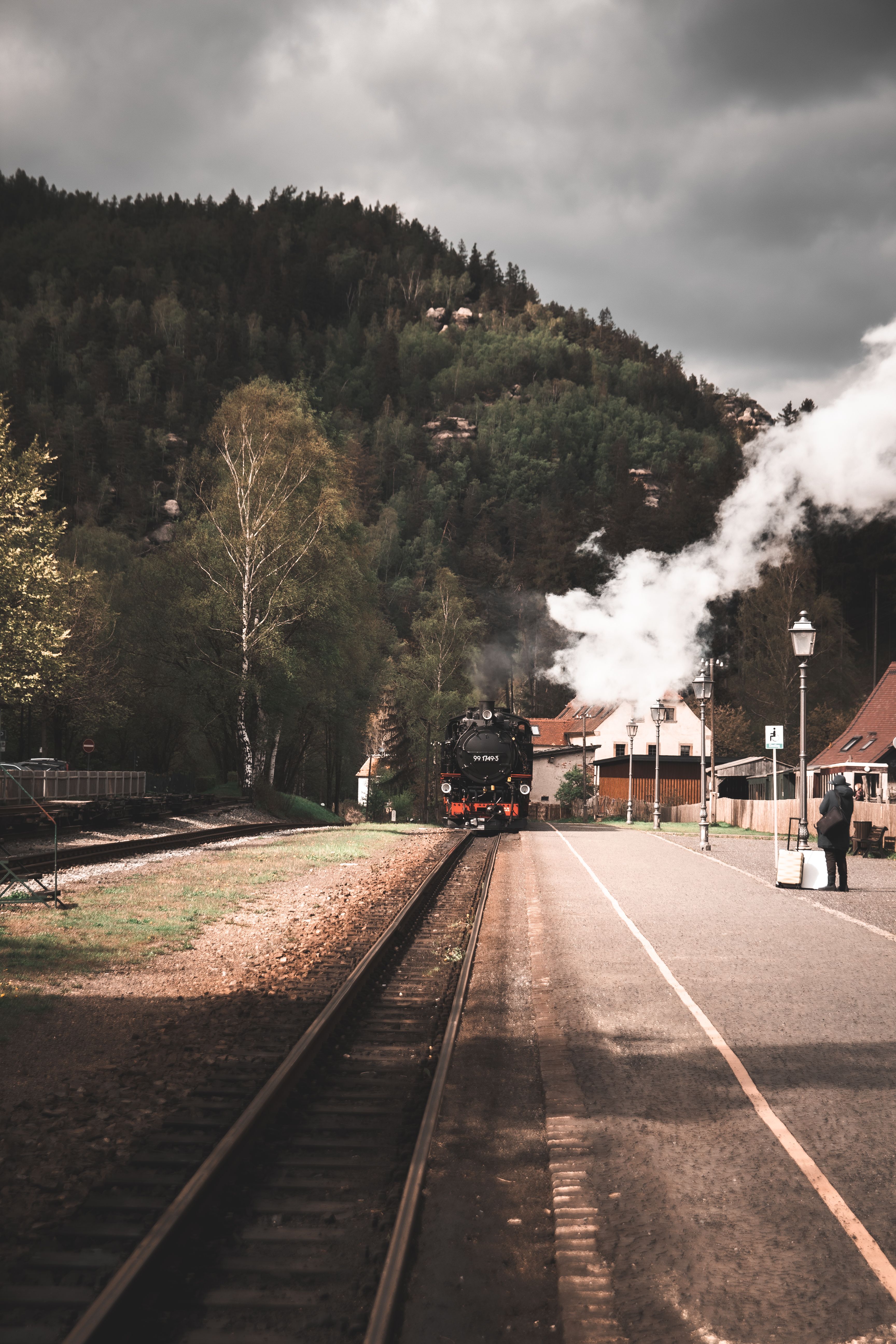 A train is coming down the tracks with smoke coming out of it · Free ...