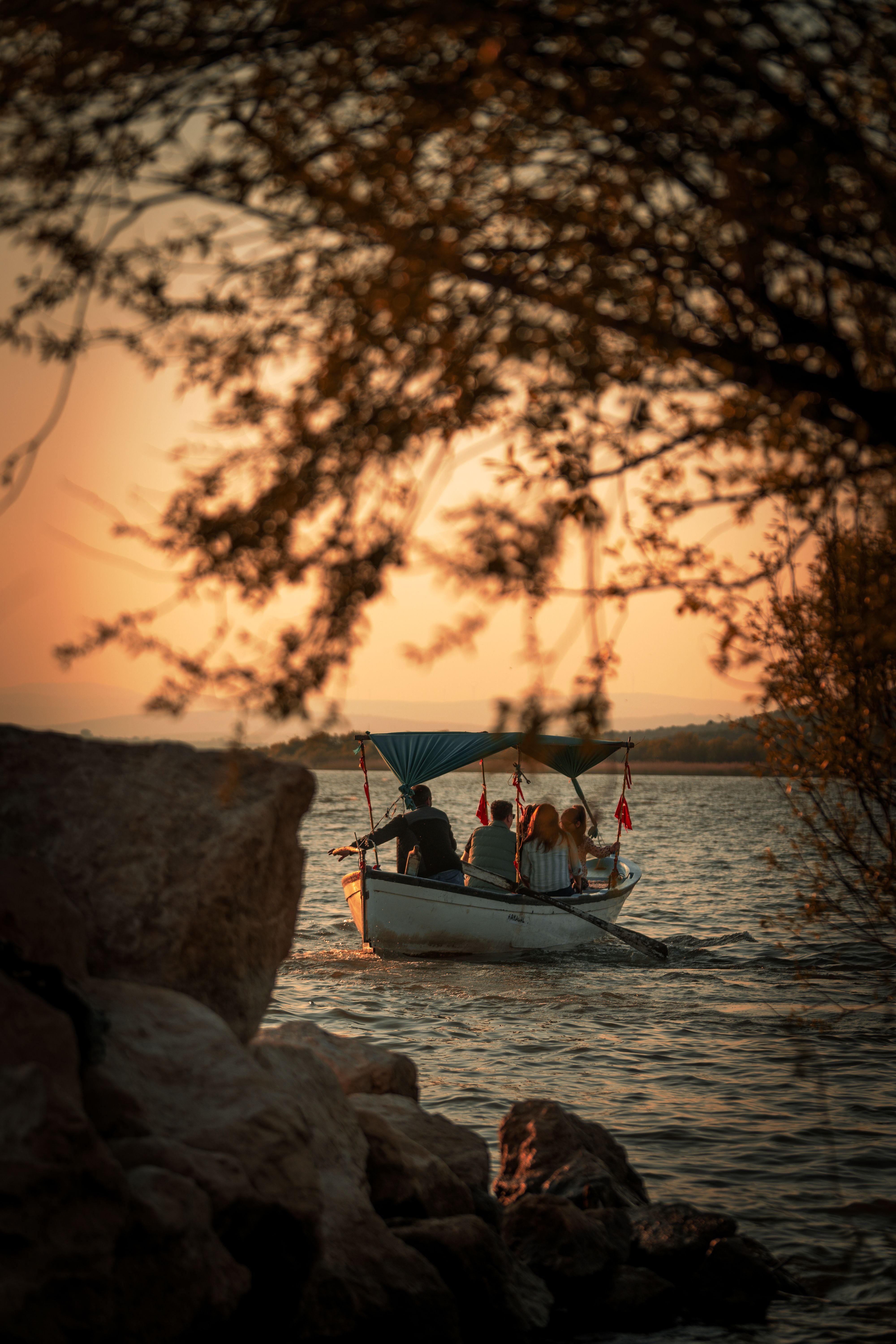 People on a Boat During Sunset · Free Stock Photo