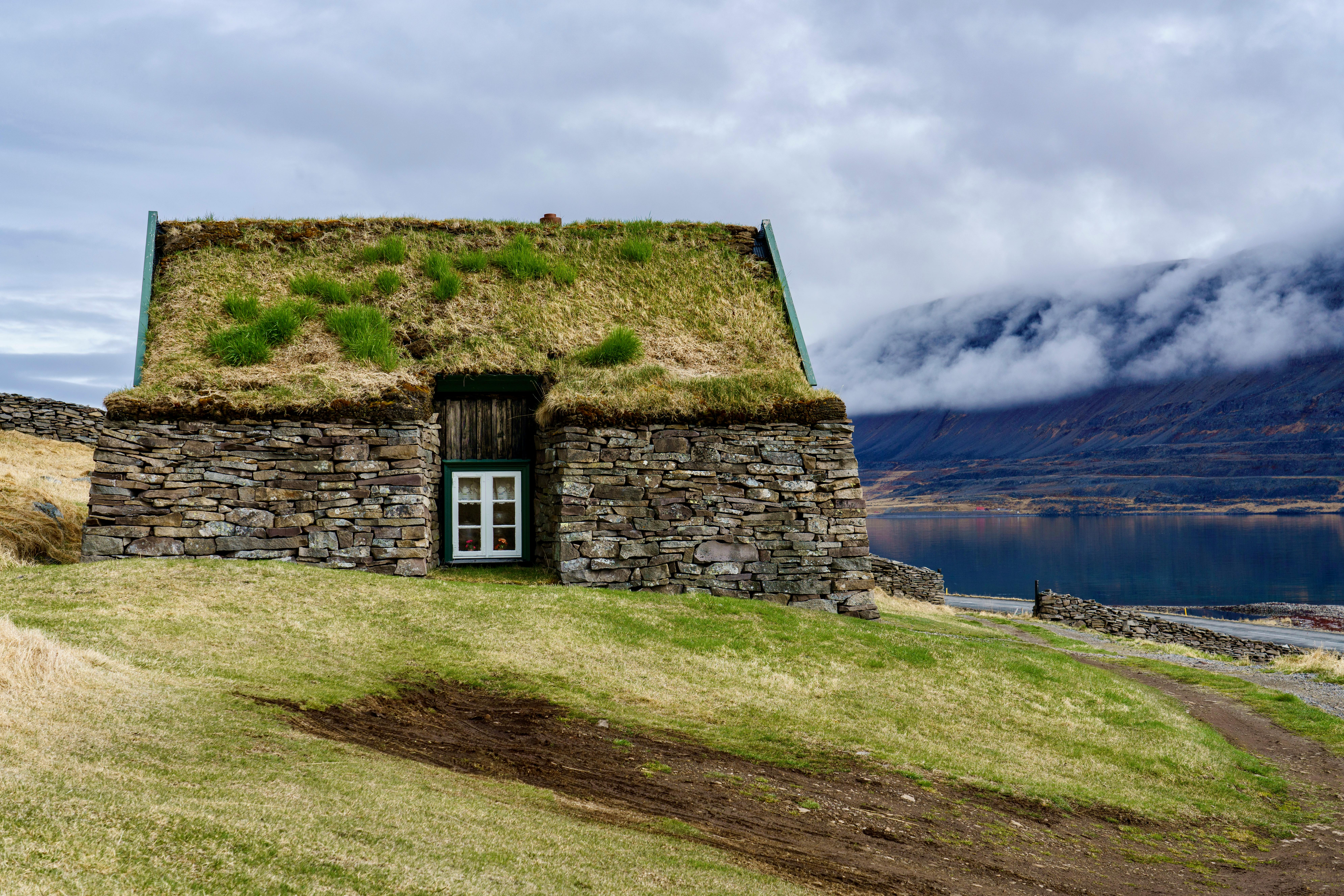 Historic Stone House with a Roof Overgrown with Grass in an Icelandic ...