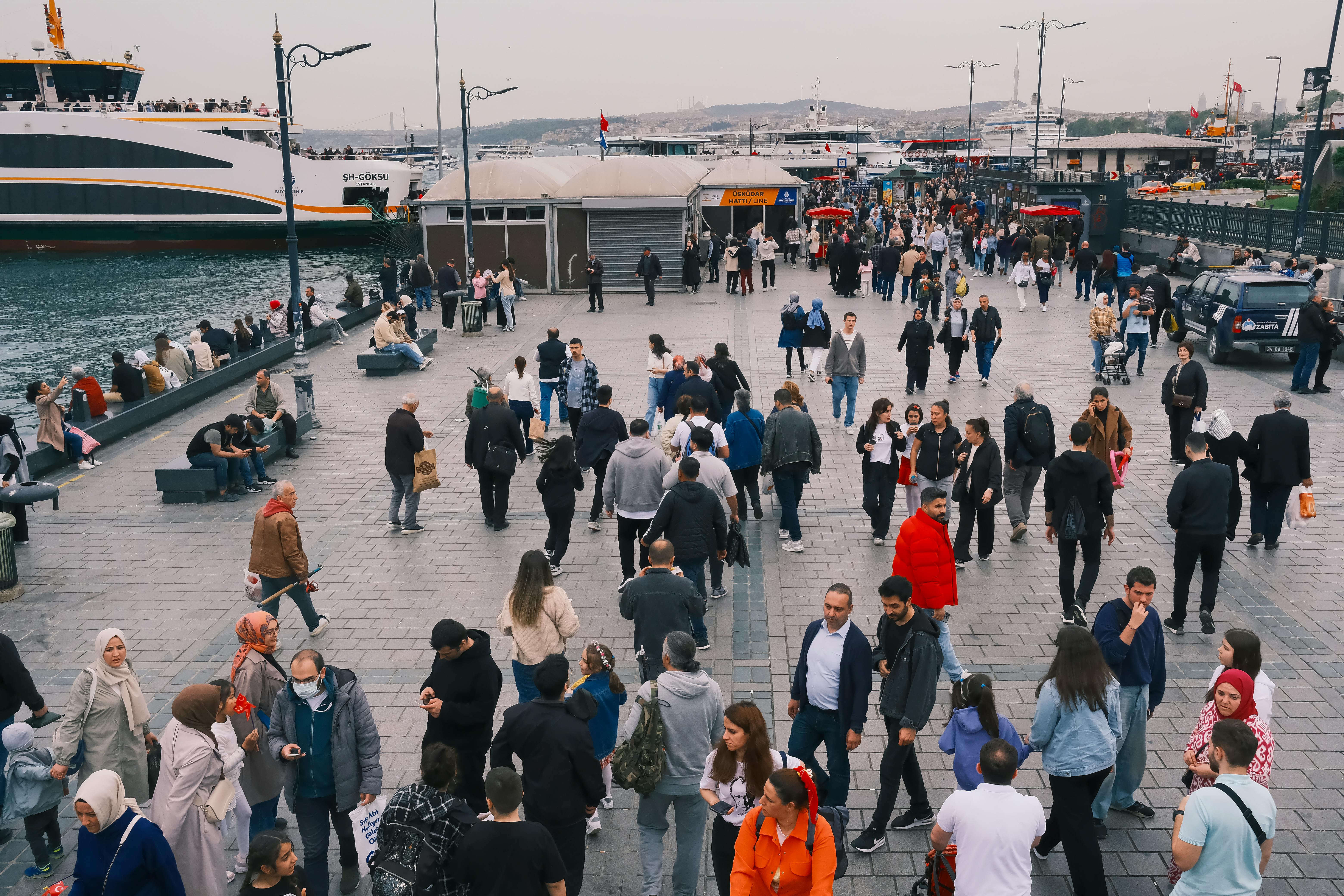A crowd of people walking on a busy street · Free Stock Photo