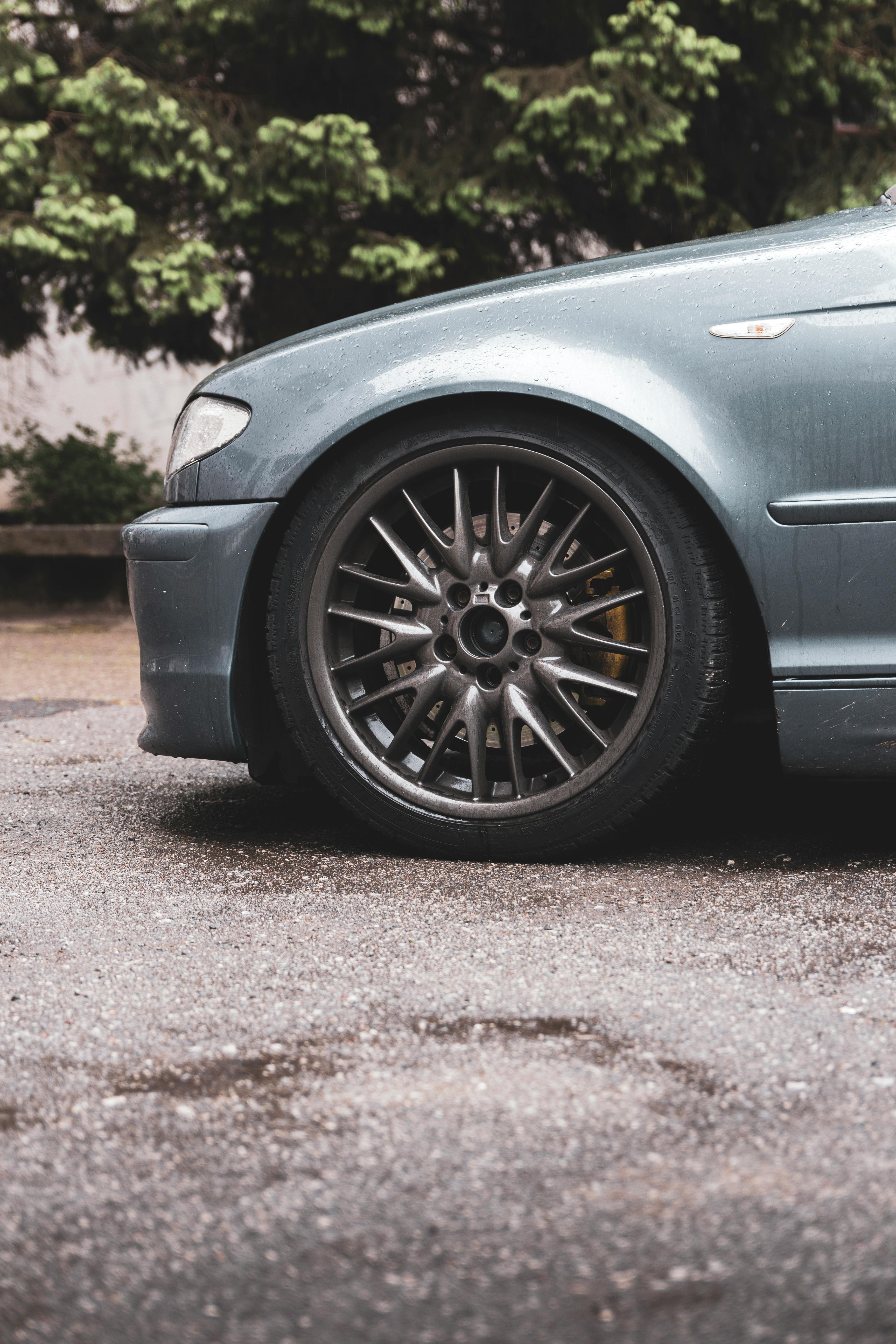 A close up of a blue car with rims · Free Stock Photo