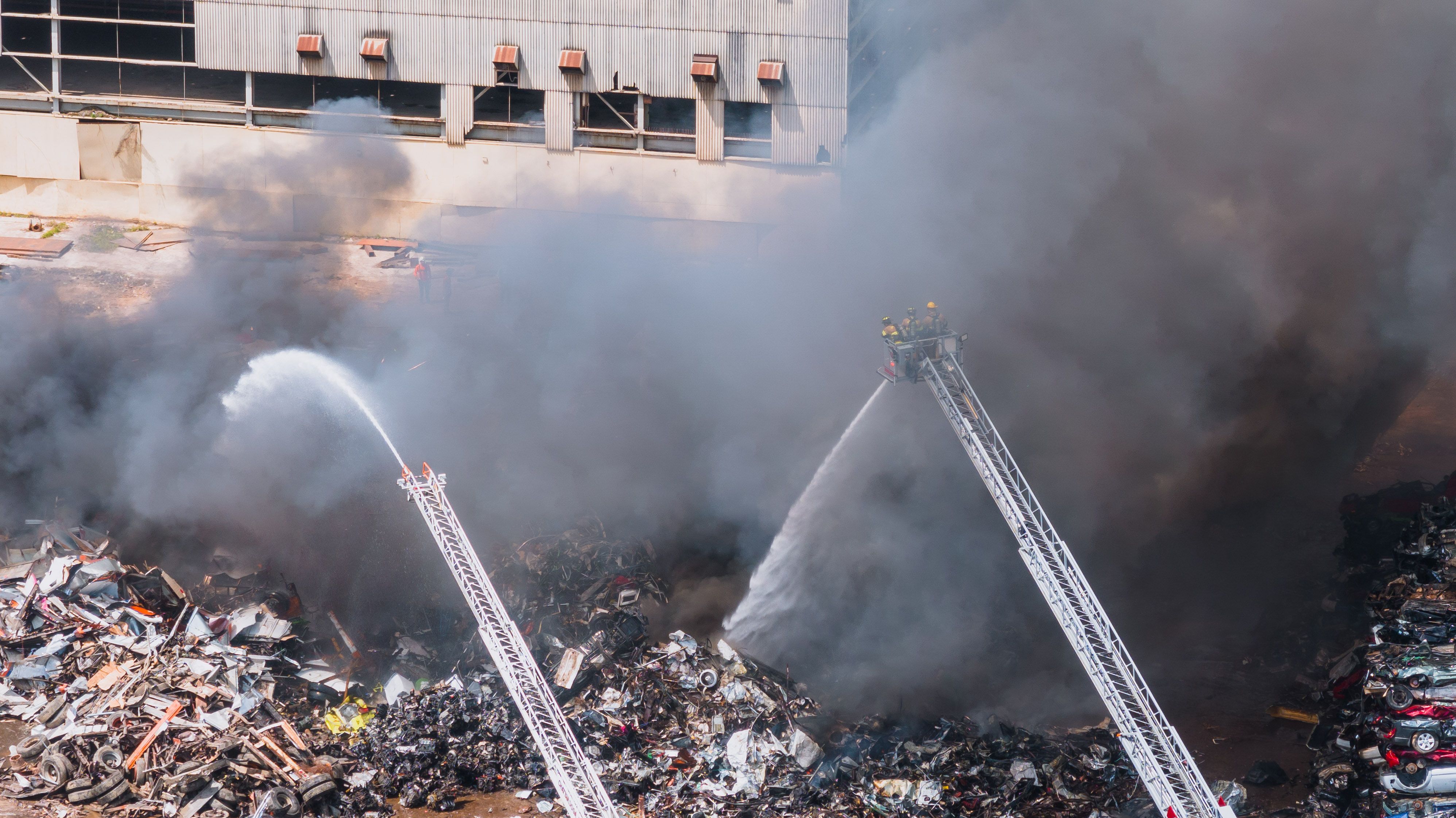 A fire is burning in a large pile of garbage · Free Stock Photo