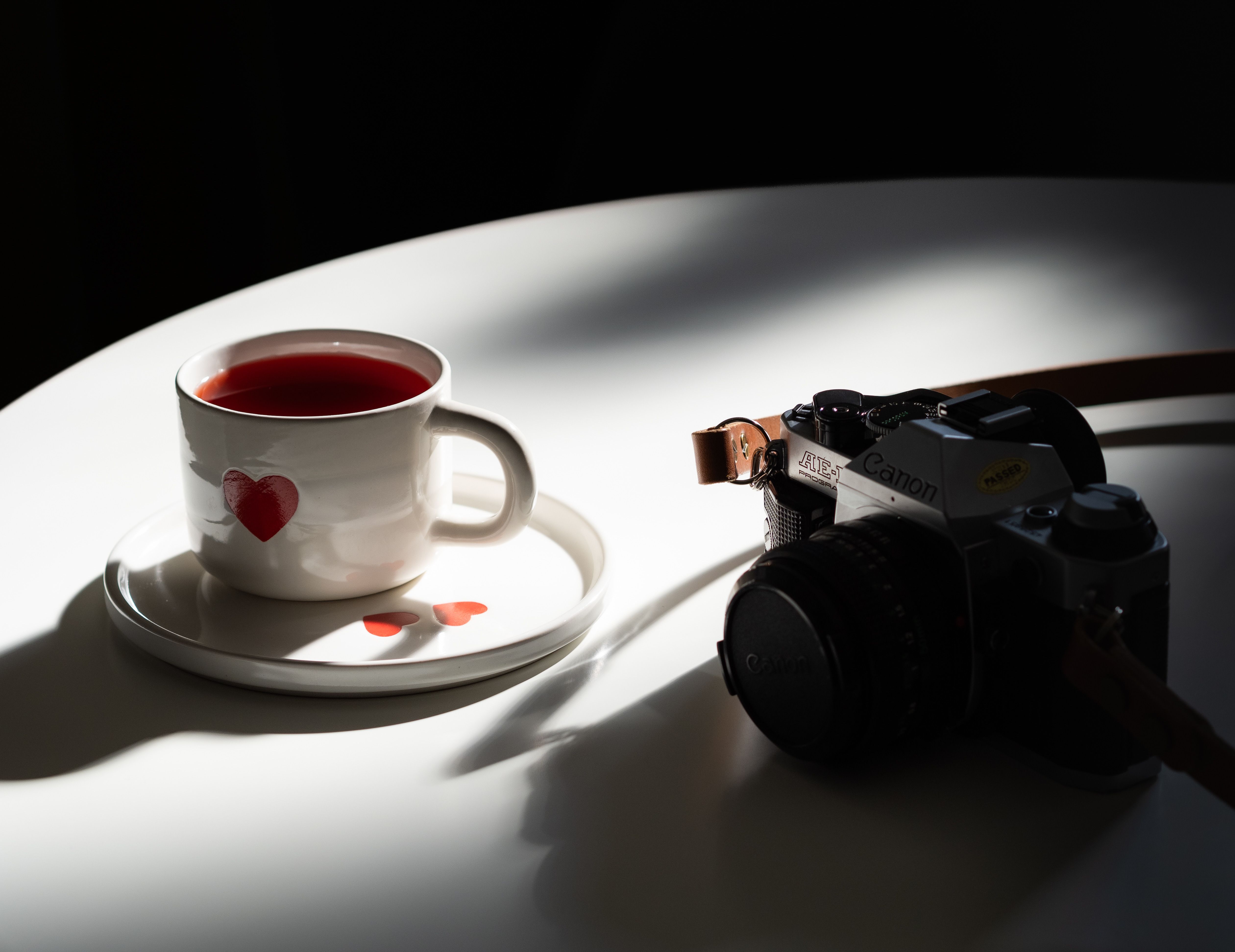 A Tea and a Camera on a Table · Free Stock Photo