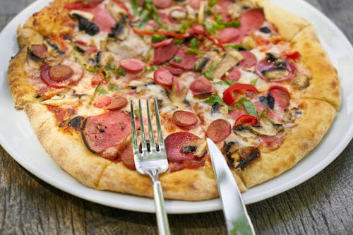 Sliced Pepperoni Pizza on White Ceramic Plate · Free Stock Photo Sliced Pepperoni Pizza on White Ceramic Plate · Free Stock Photo