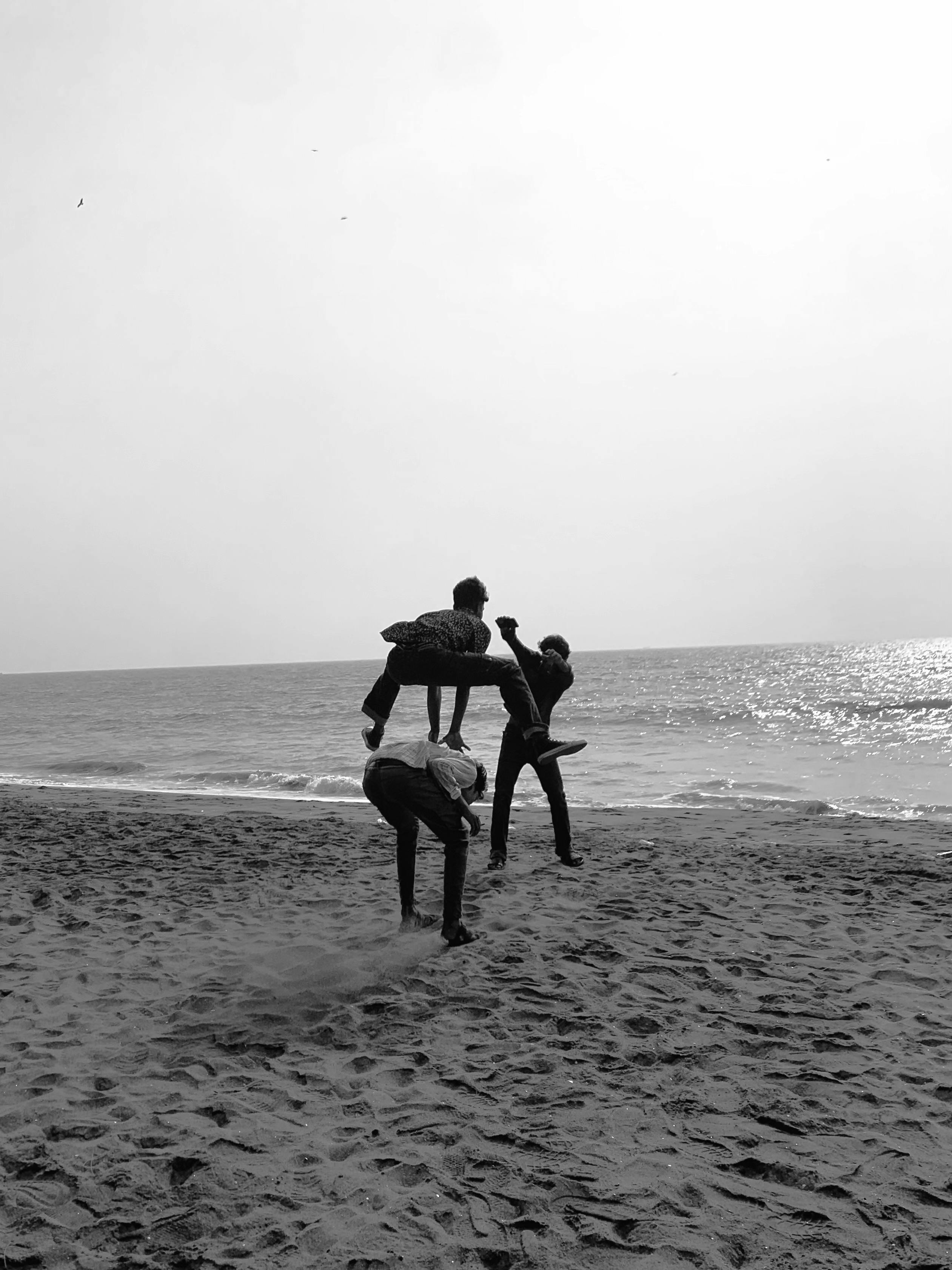 Man Jumping and Playing on Beach · Free Stock Photo