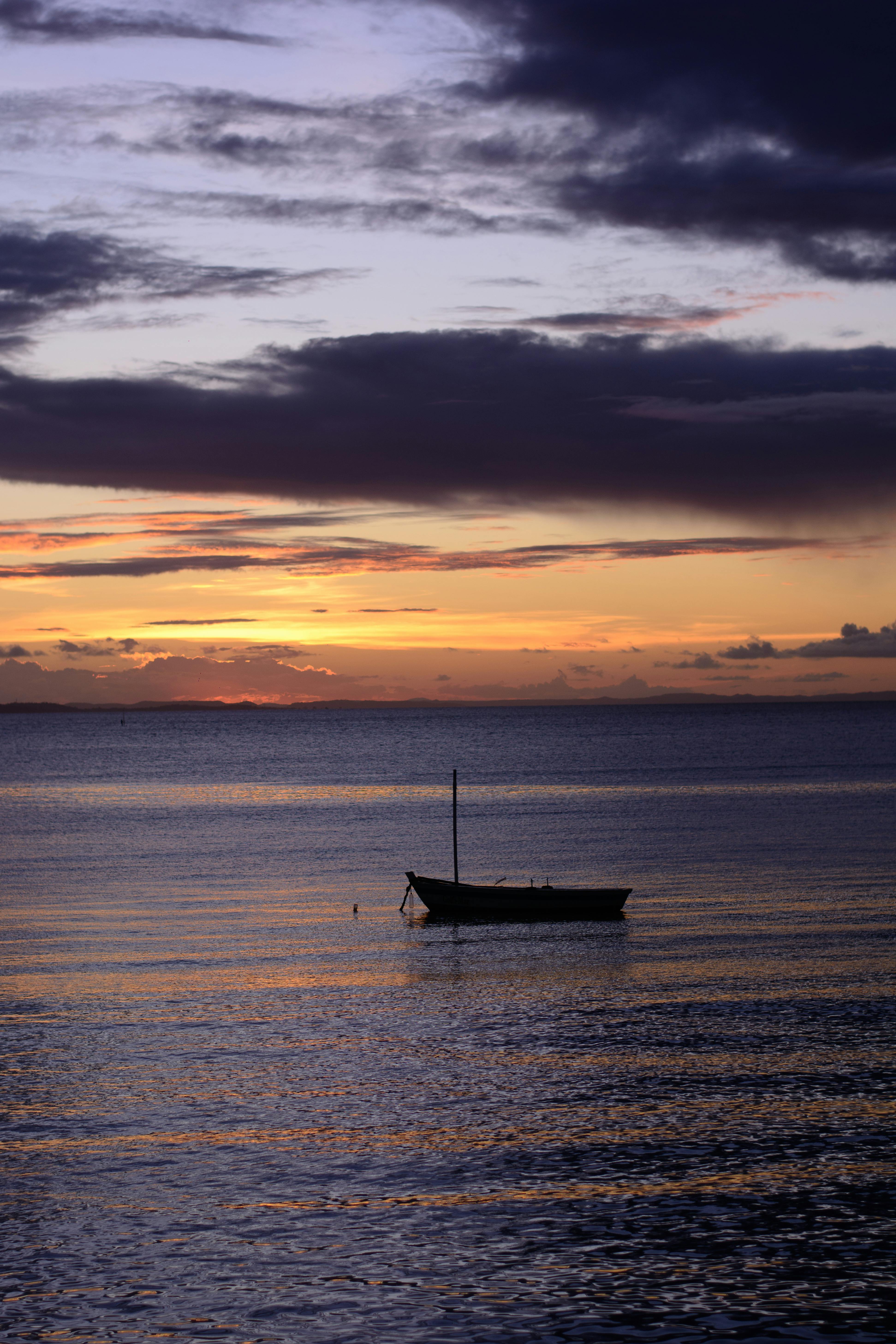 Boat on Calm Sea Coast at Sunset · Free Stock Photo