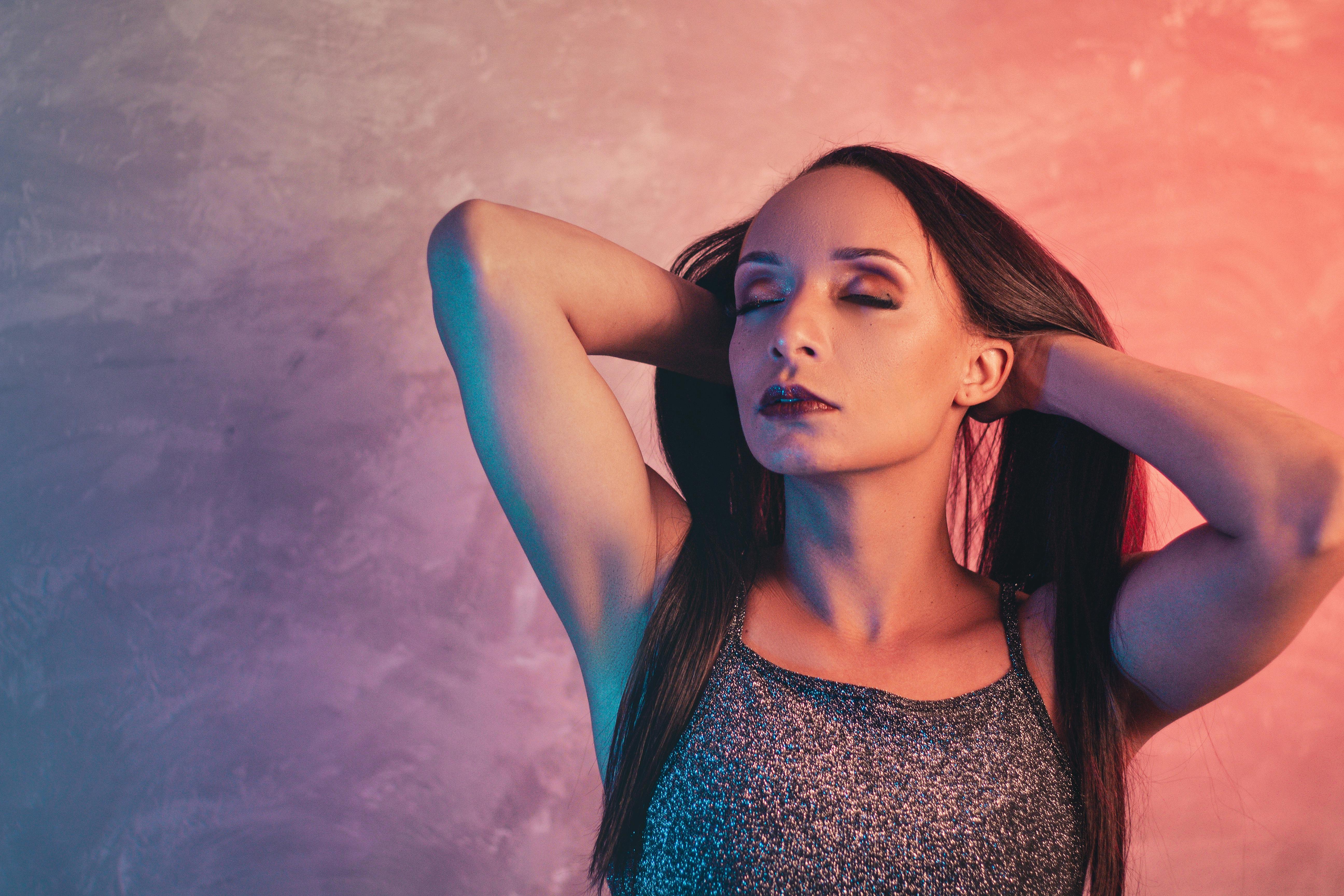 Portrait of Woman Fixing Hair · Free Stock Photo