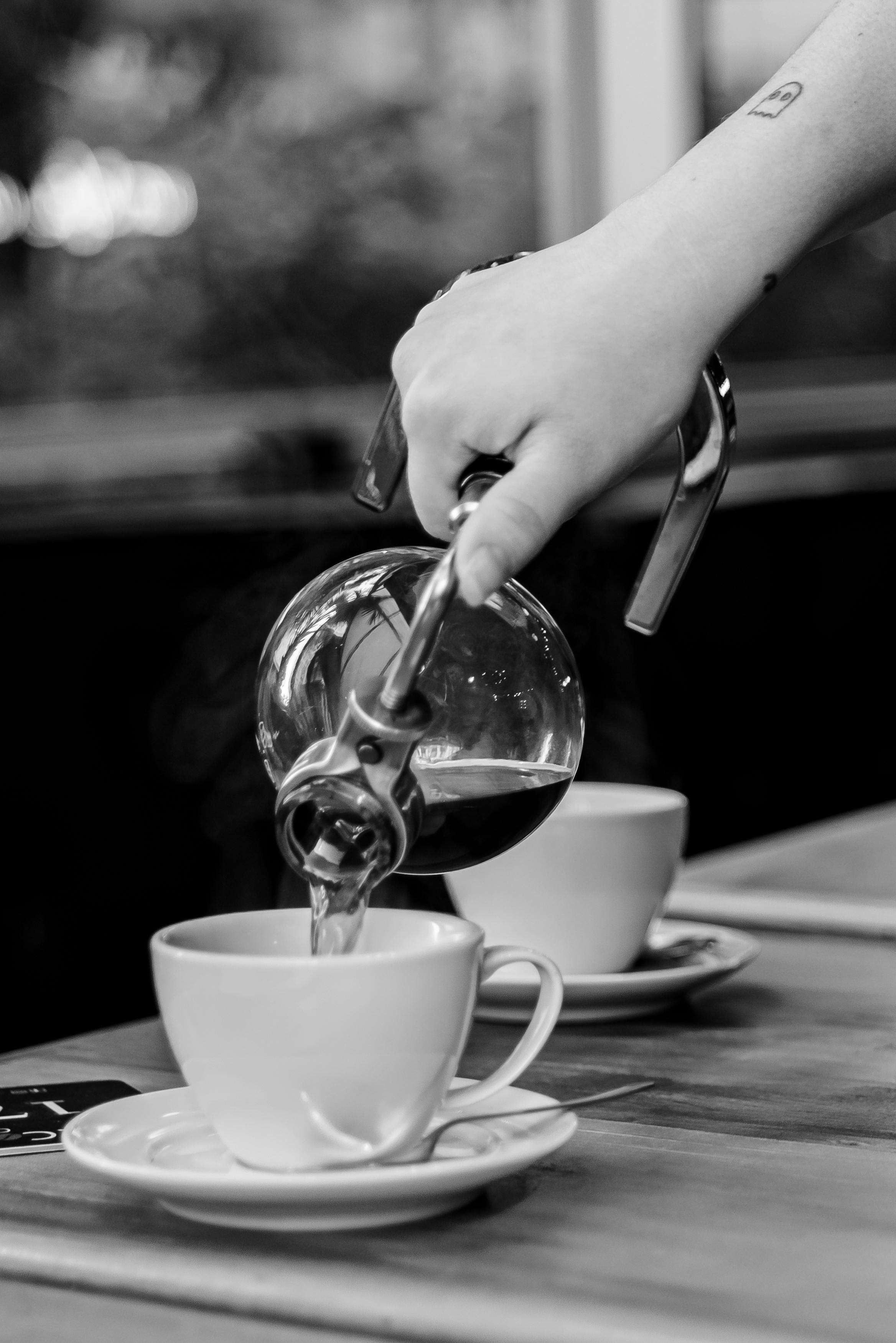 Person Pouring Tea on Cup · Free Stock Photo