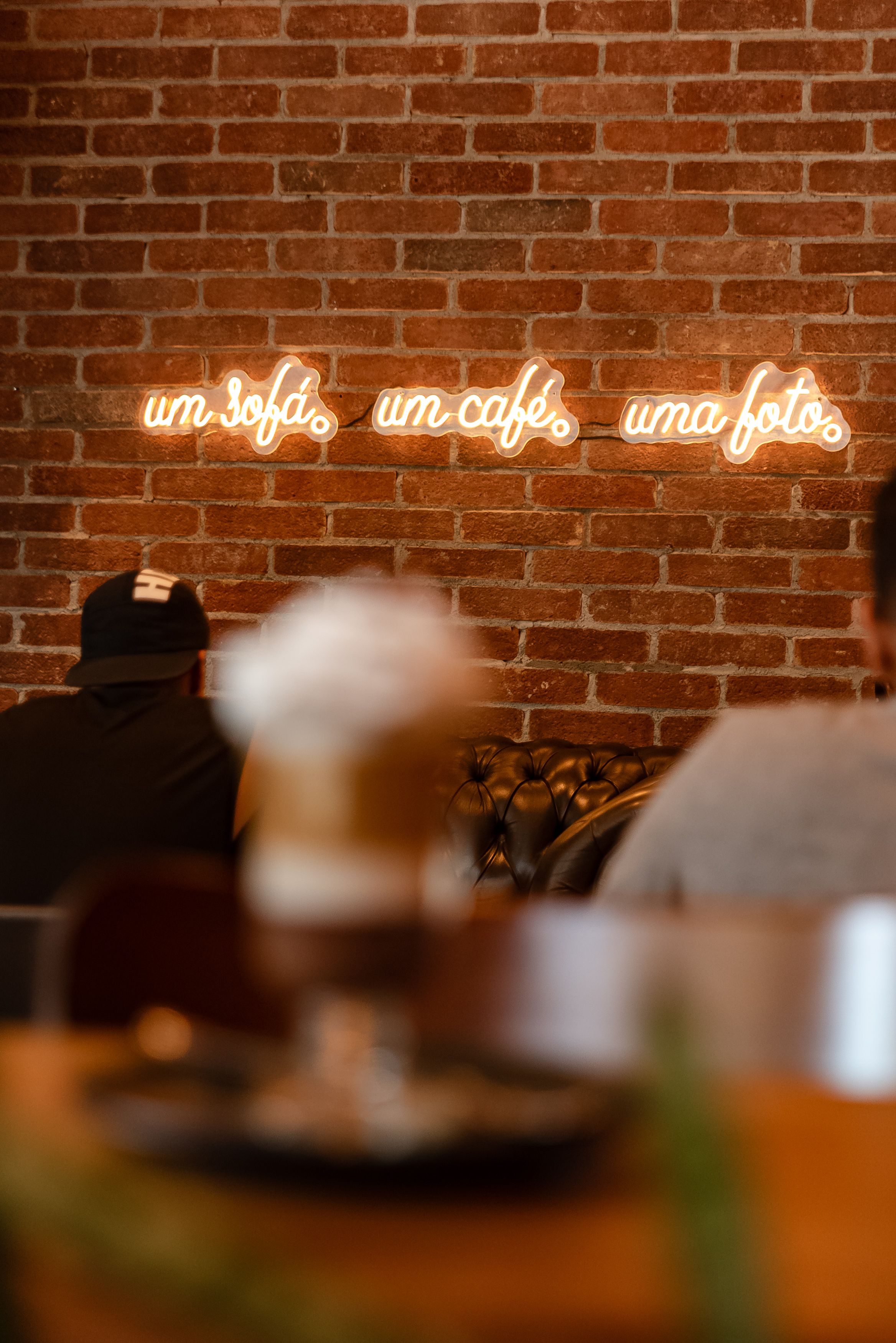 Glowing Sign on a Brick Wall · Free Stock Photo