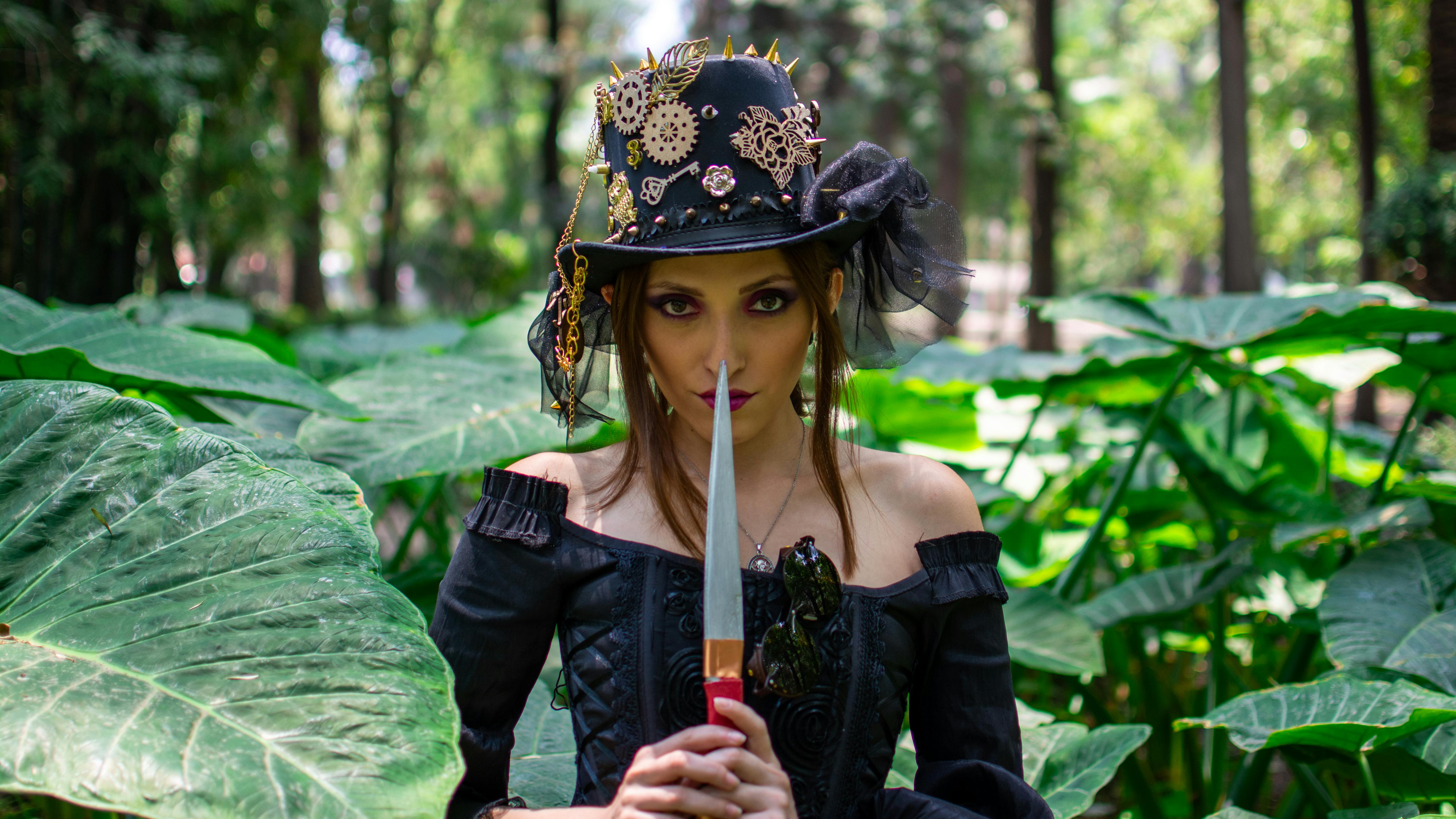 Woman in Dress, Costume Hat and with Dagger · Free Stock Photo