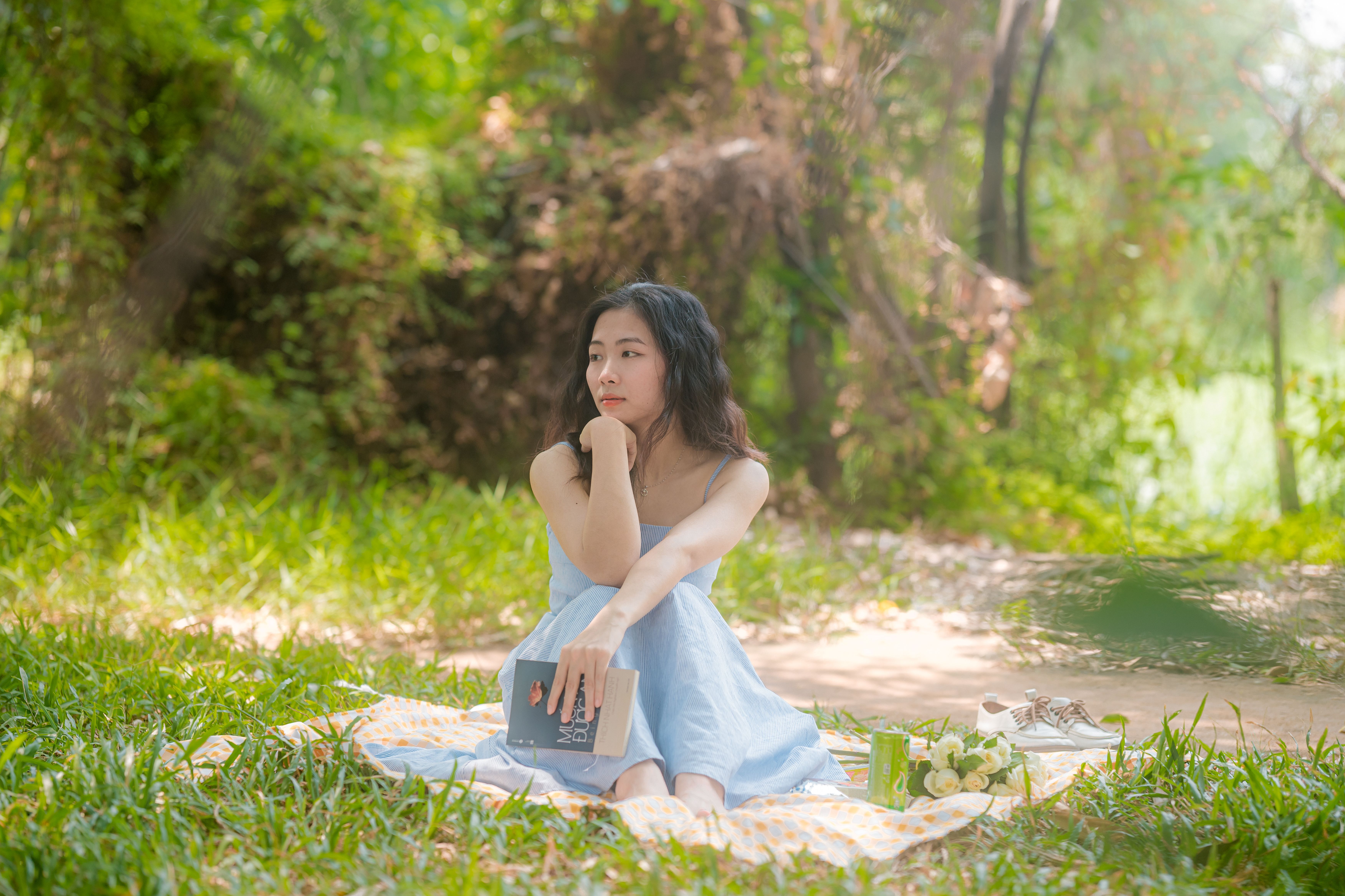 Woman Sitting on Green Grass Field · Free Stock Photo