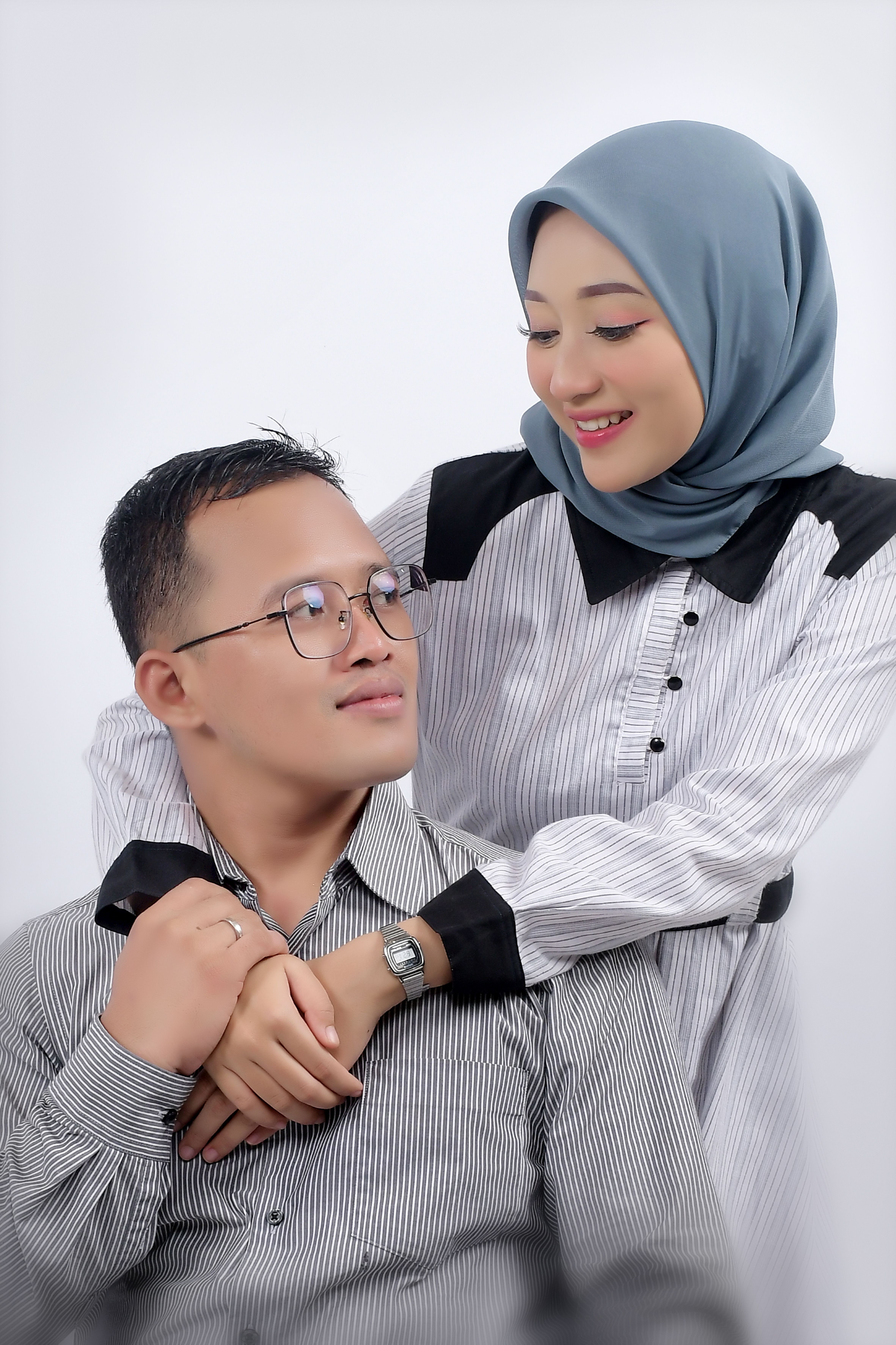 Studio Shot of a Woman Wrapping Her Hands around Her Partners Shoulders ...