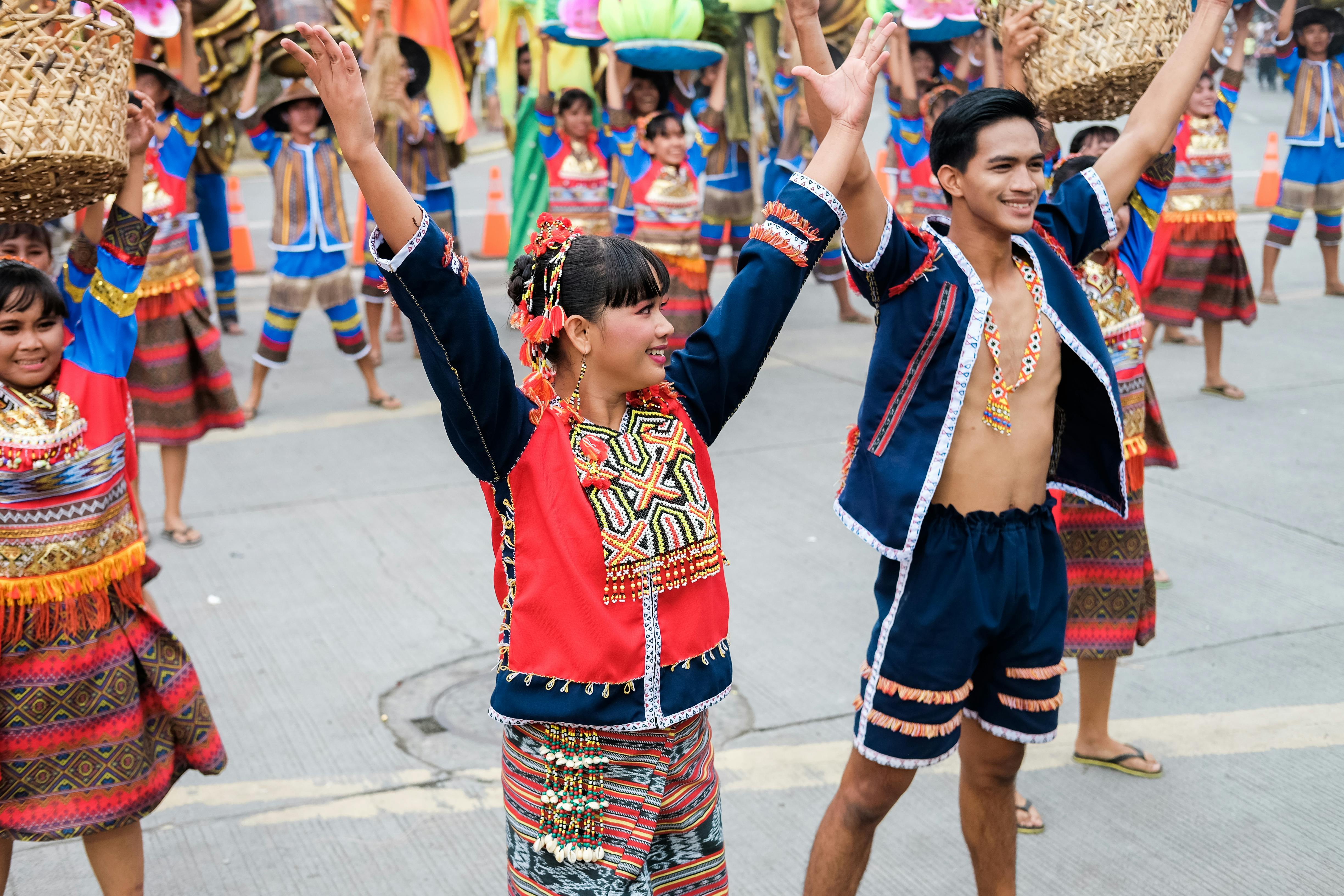 Woman Wearing Yellow And Red Traditional Dress Dancing Near Building ...
