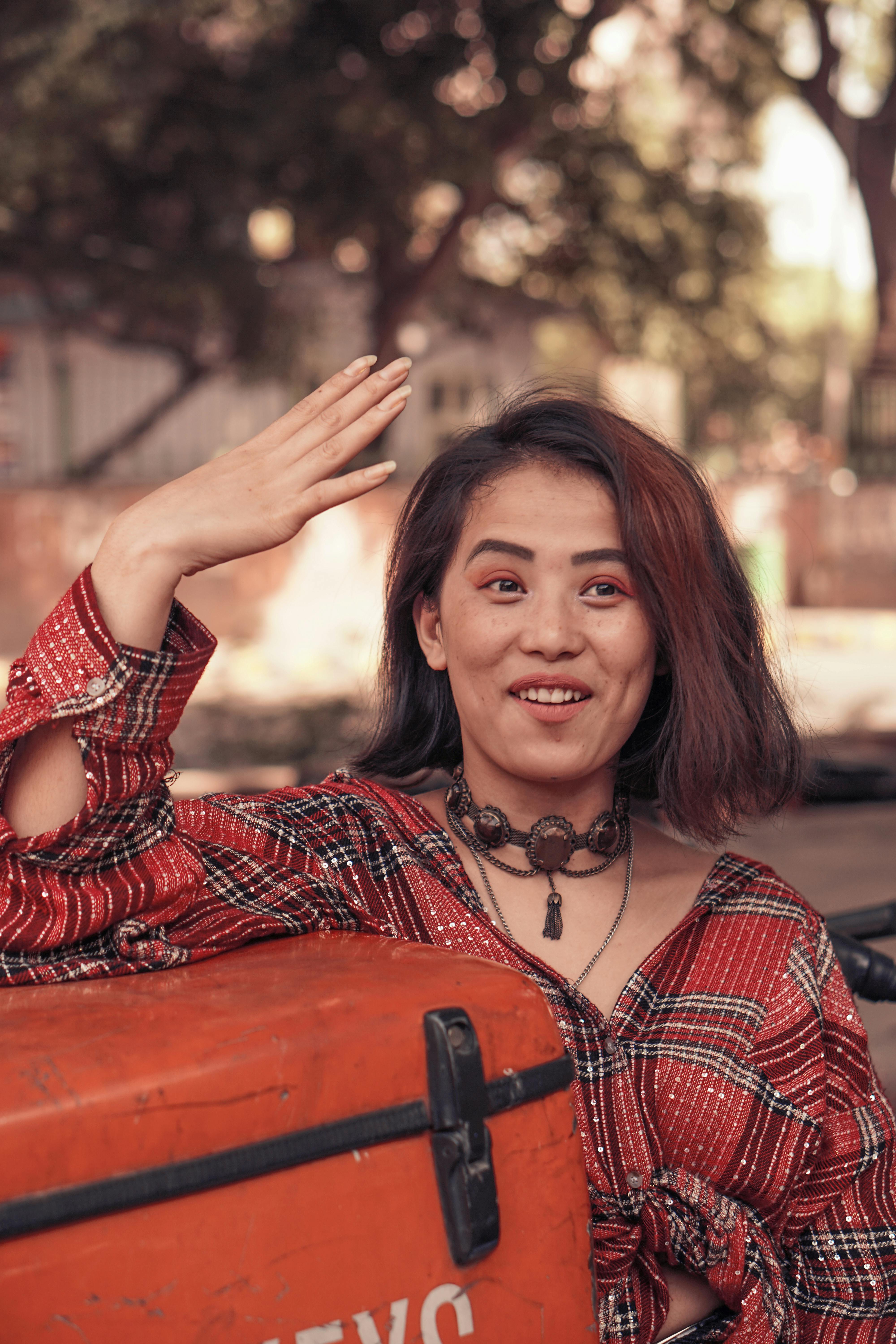 Woman Raising Right Hand · Free Stock Photo